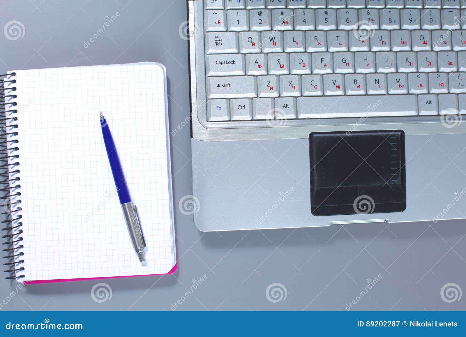 A Note Book, Laptop, Pen, Graph Paper Document on the Office Desk Table ...