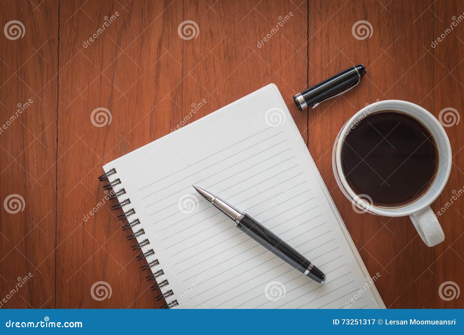 Note Book with Pen and a Cup of Coffee on Wood Table. Stock Image ...