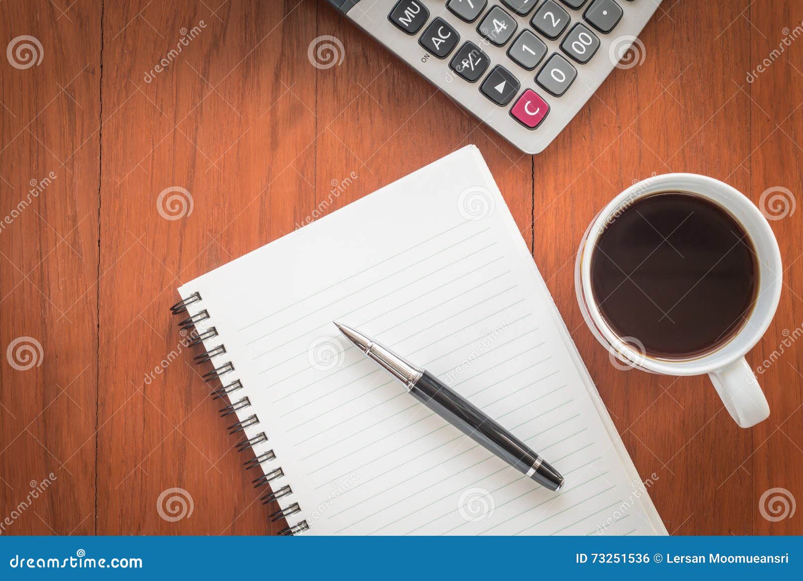 Note Book with Pen and a Cup of Coffee on Wood Table. Stock Photo ...
