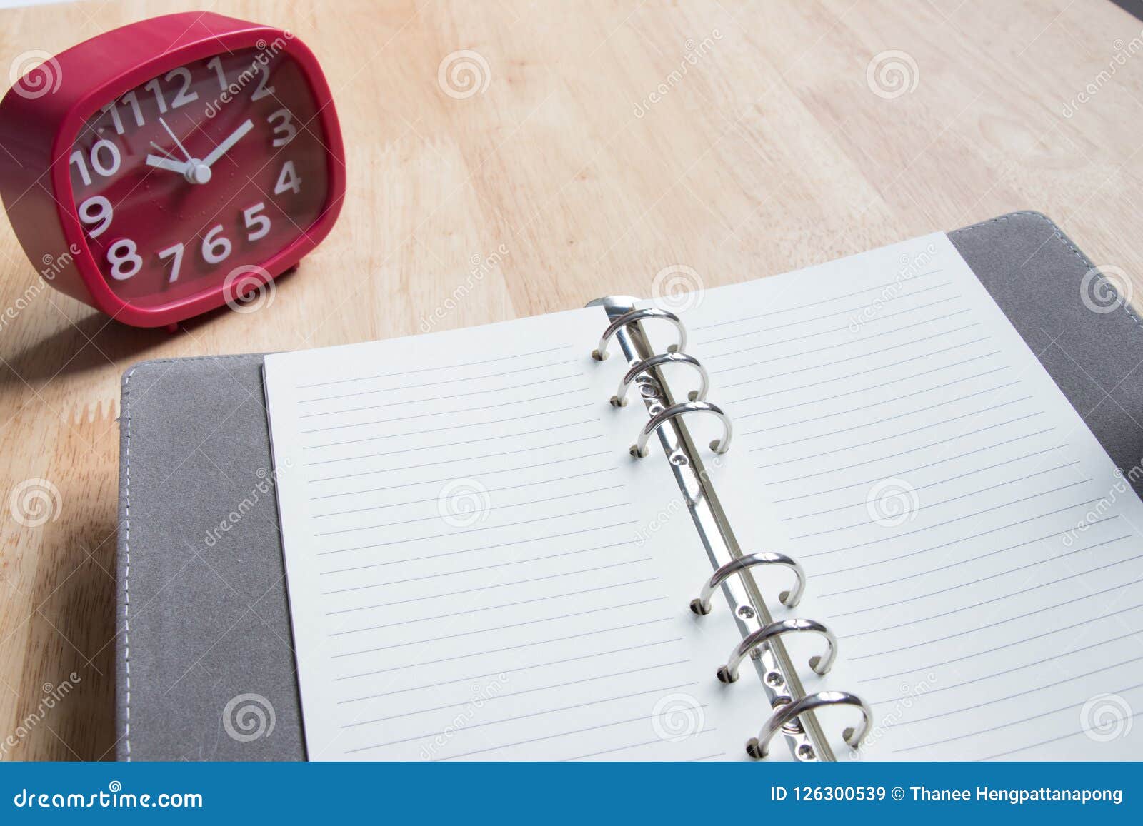 Note Book with Red Clock on Wood Table Background Stock Image - Image ...