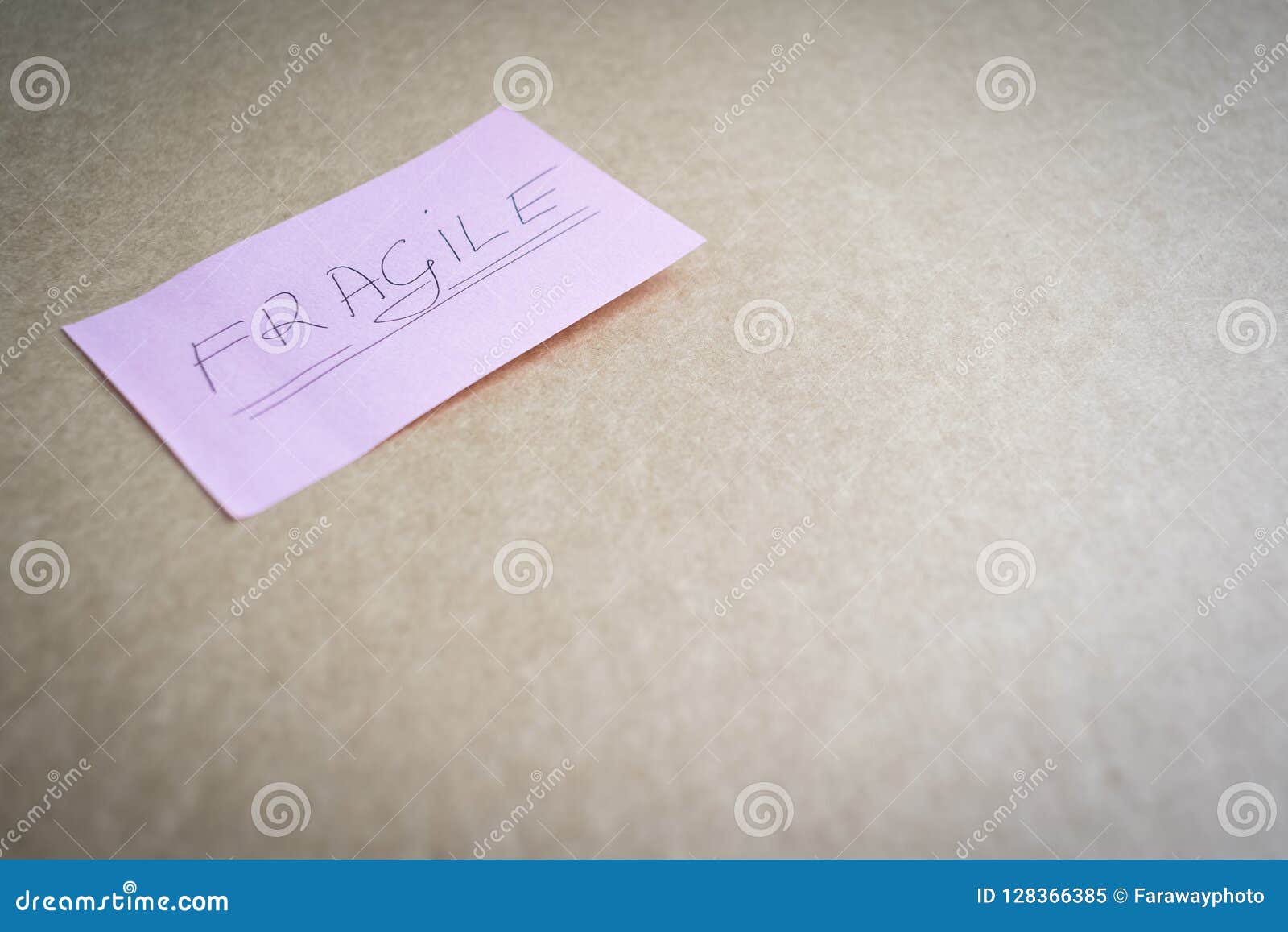 Note `fragile` On A Pink Sticker On A Cardboard Surface. Royalty-Free ...