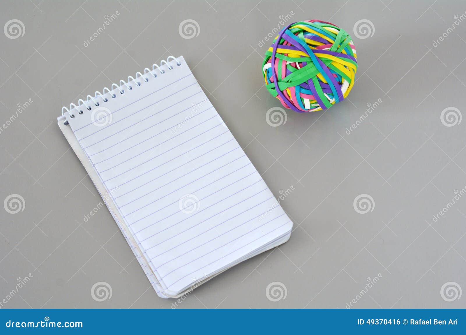 Note Pad with Rubber Band Ball Stock Photo - Image of diversity, blank ...