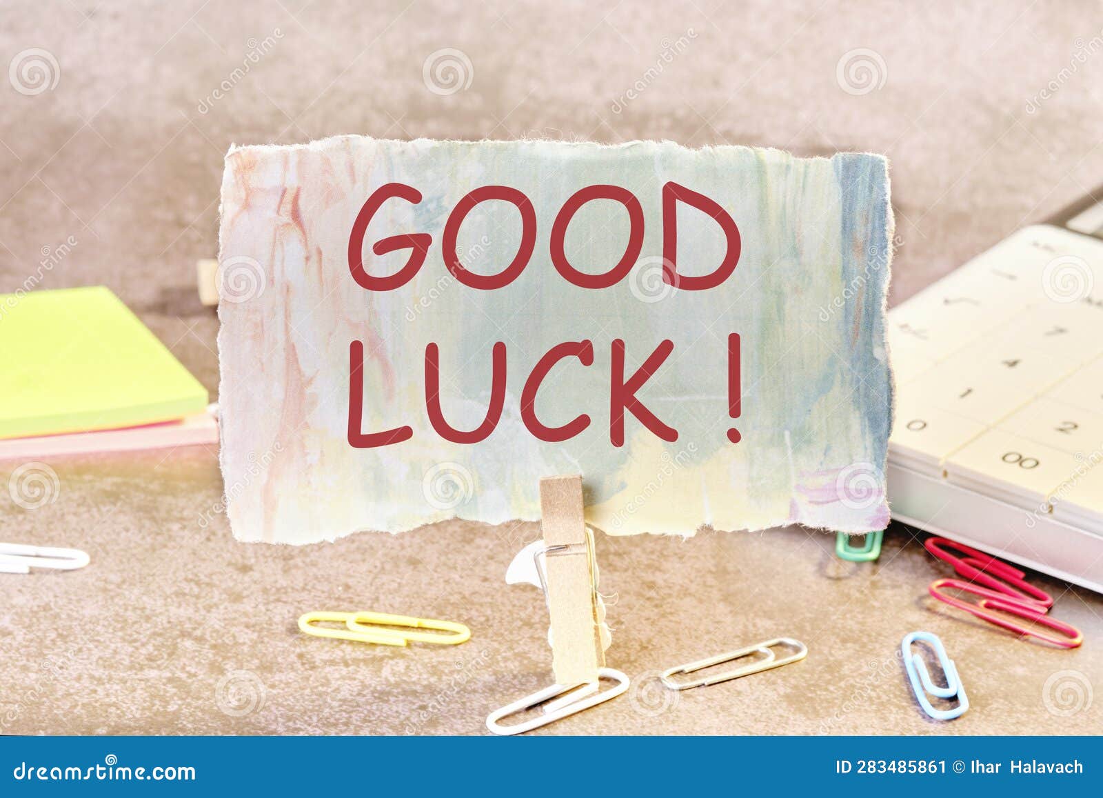 A Note on Paper with Good Luck Wishes on the Table Secured with a ...