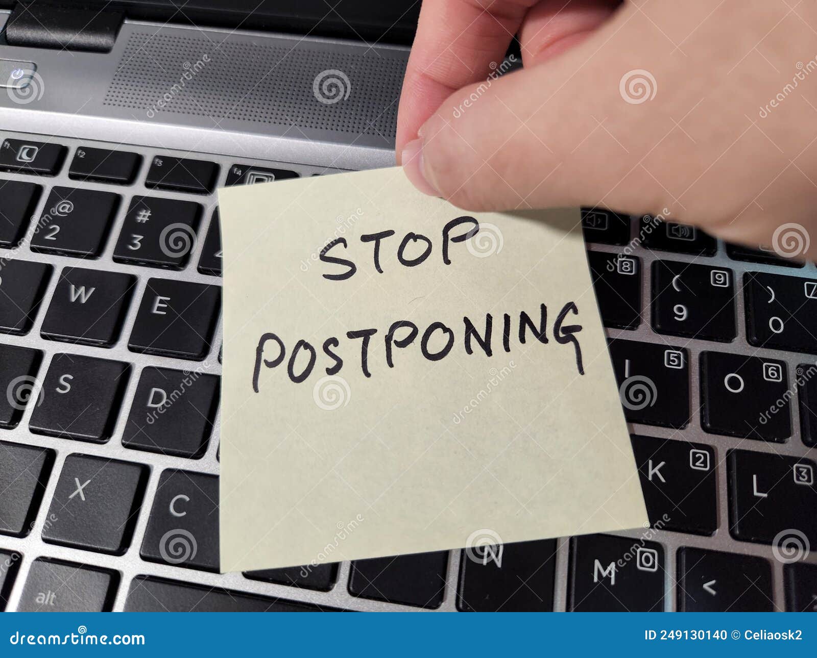A Note Showing the Phrase Stop Postponing Stock Photo - Image of ...