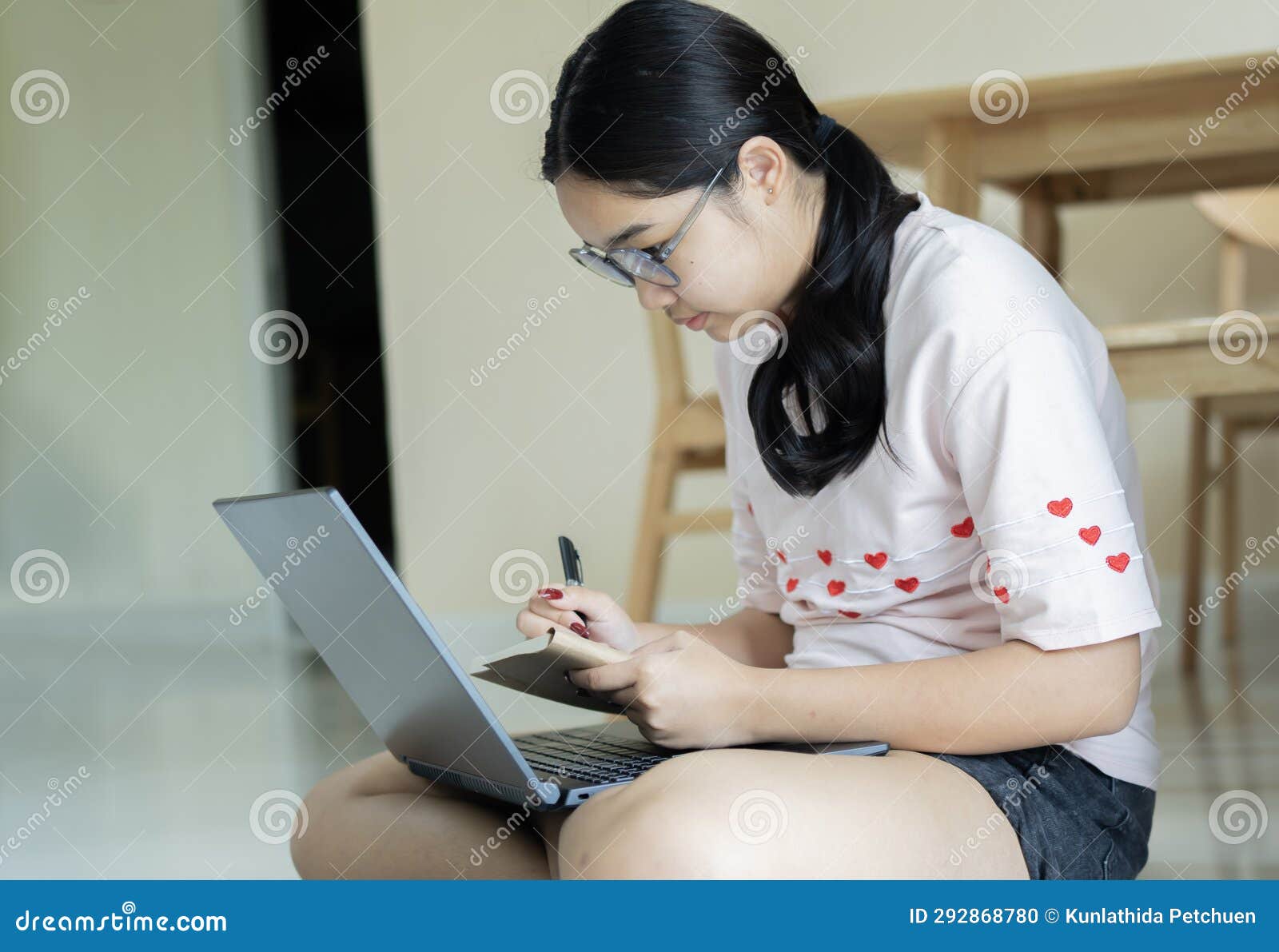 Note Taking. Side View Portrait of Female Student Using Laptop and ...