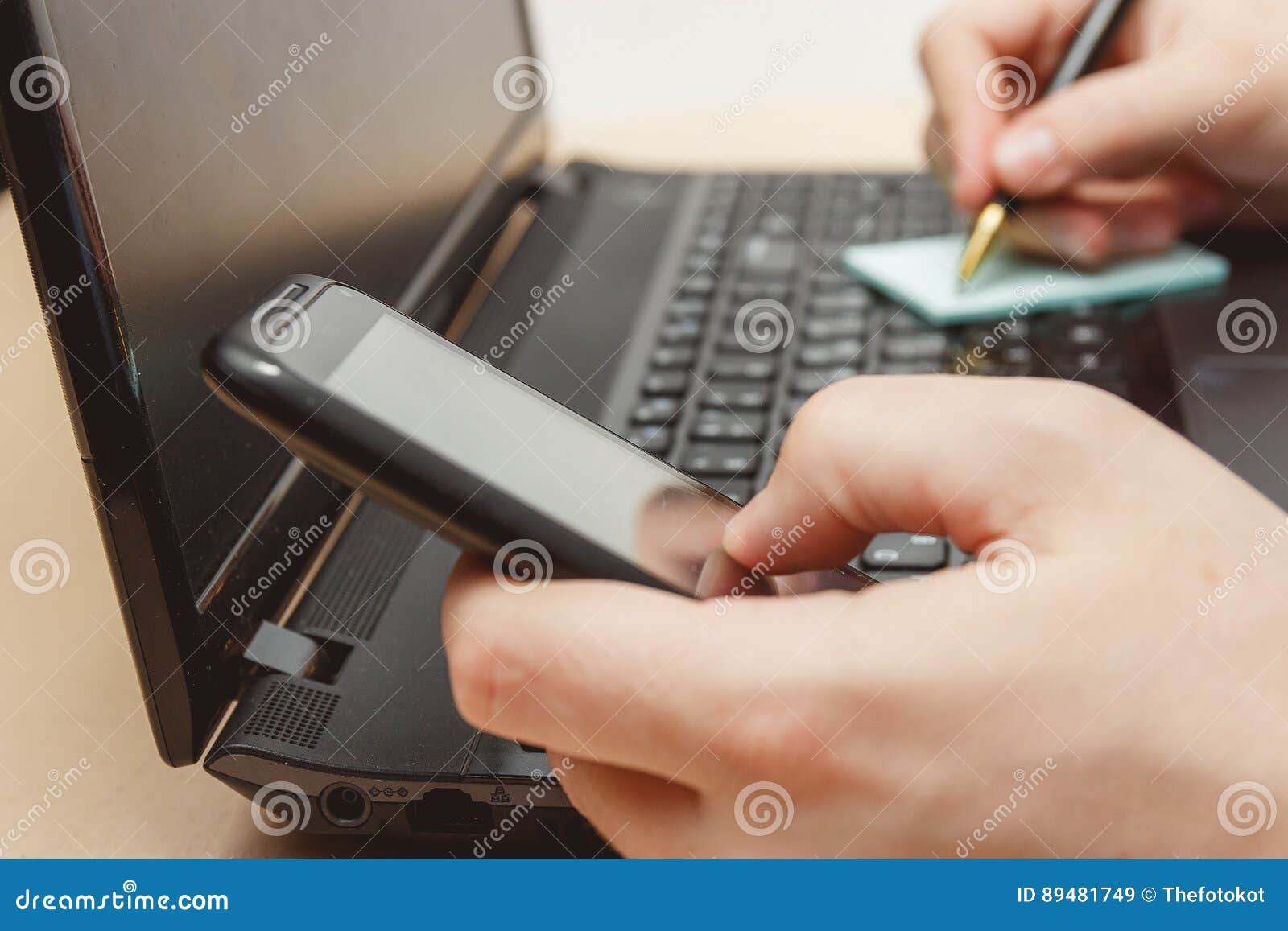 Note Taking while Use Smartphone and Laptop Computer Stock Image ...