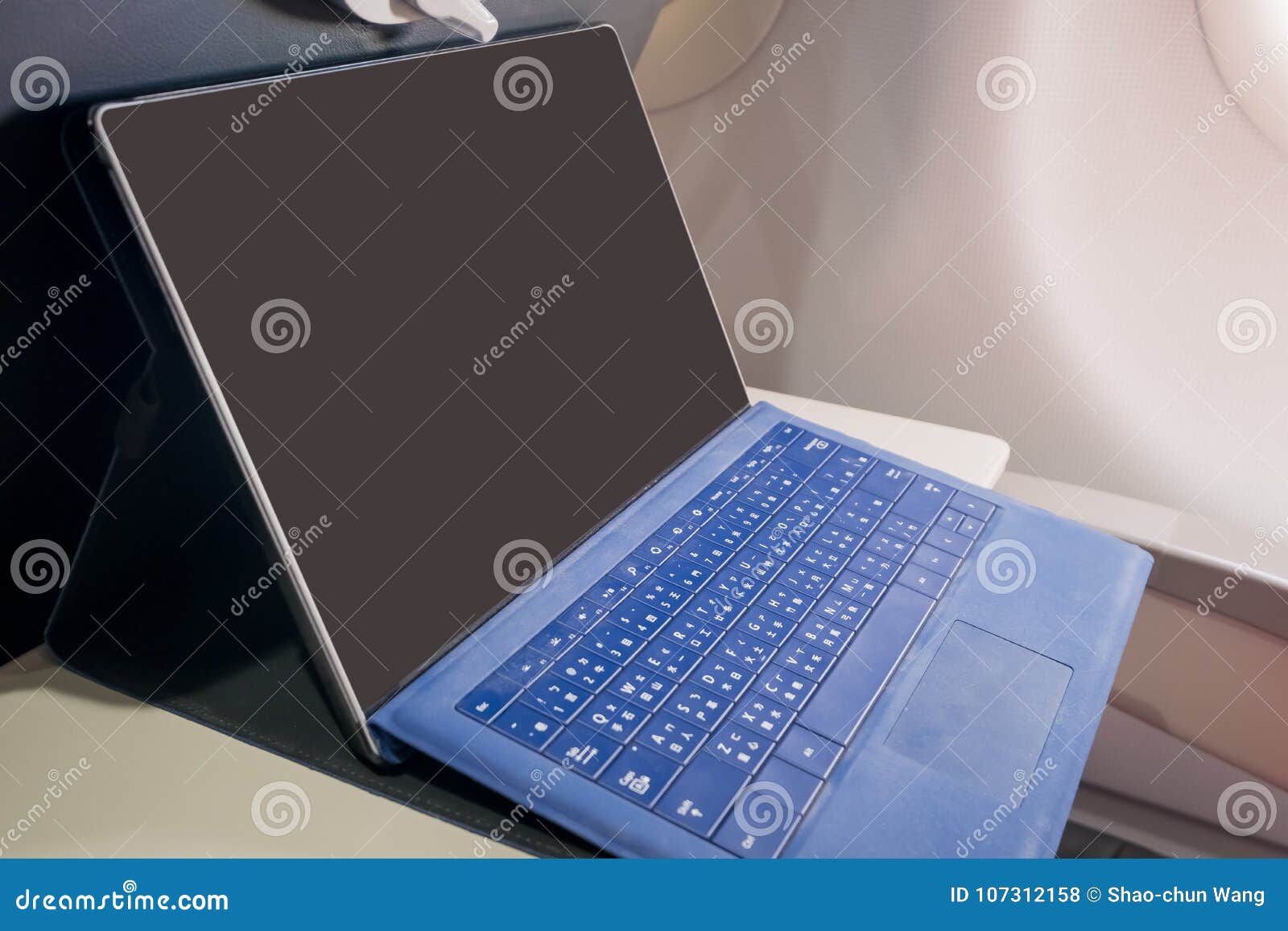 Notebook in the airplane stock photo. Image of notebook - 107312158