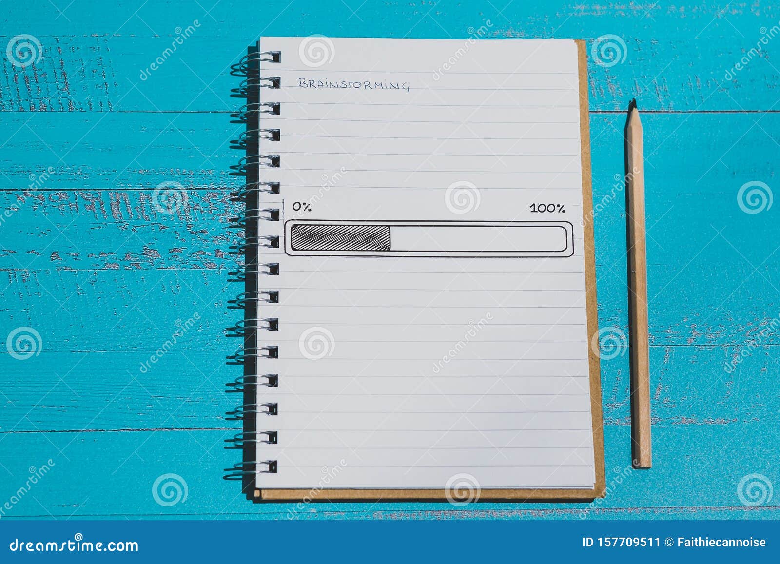 Notebook with Brainstorming Title on Page and Progress Bar Loading ...