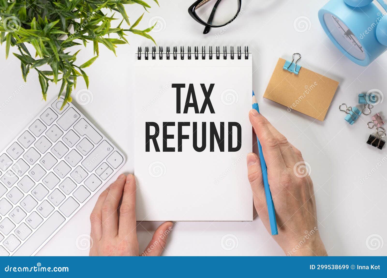 Notebook with a Business Notes TAX REFUND on the Office Table with ...