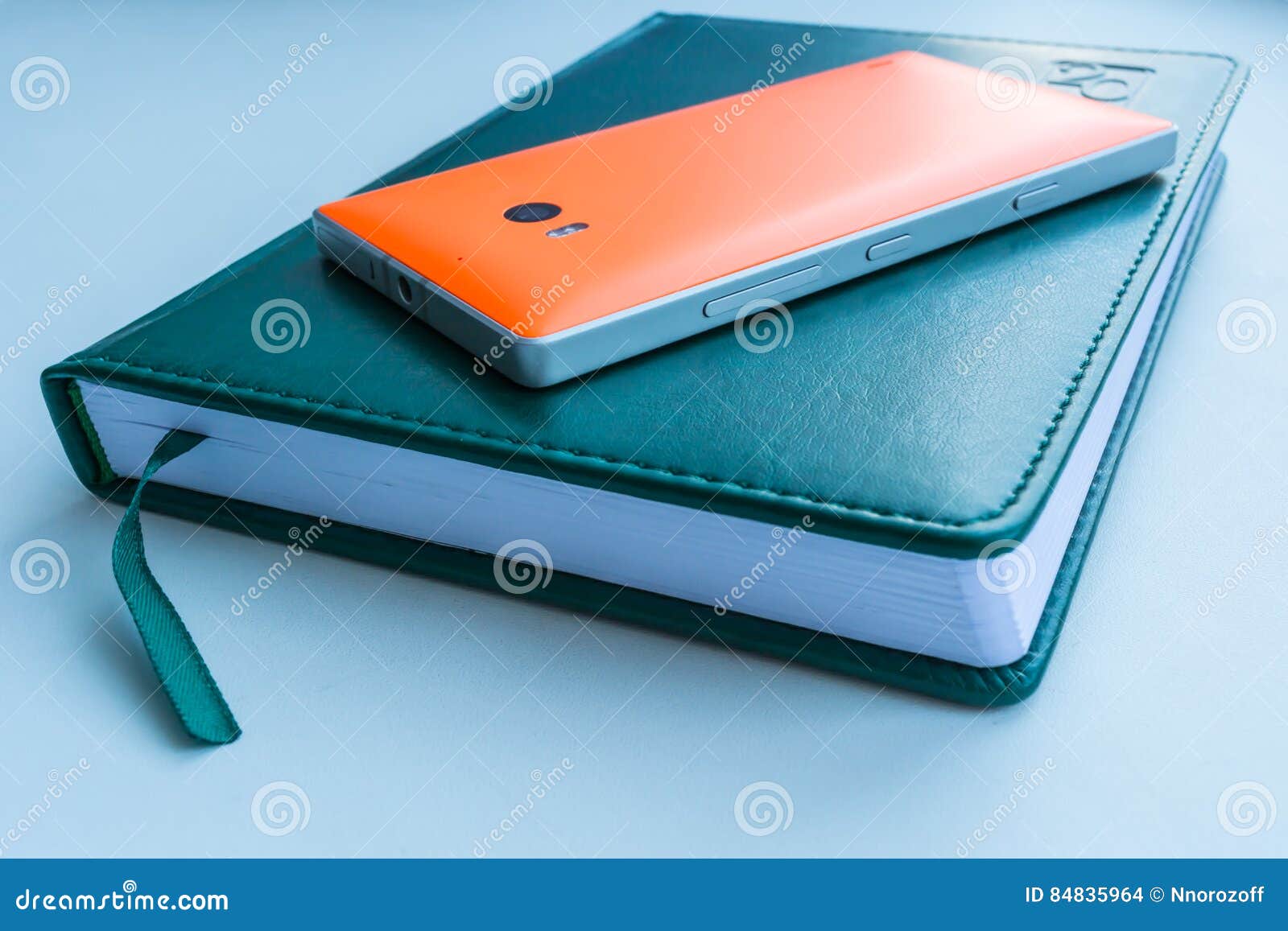 Notebook and cell phone stock photo. Image of note, orange - 84835964