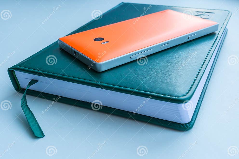 Notebook and cell phone stock photo. Image of note, orange - 84835964