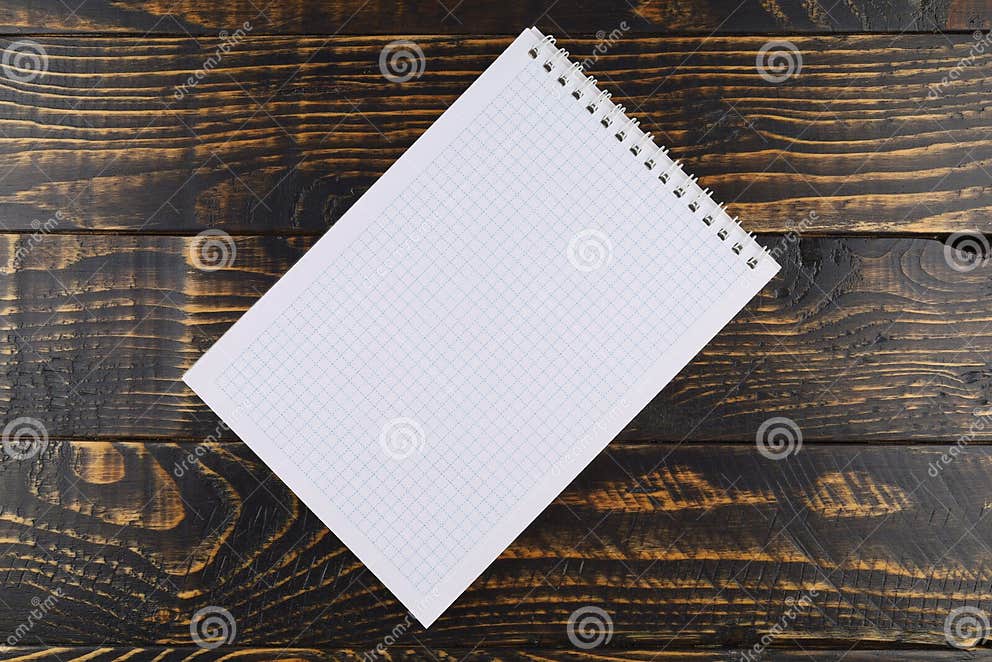 Notebook with Cells on a Wooden Background. Empty Notebook on Wooden ...