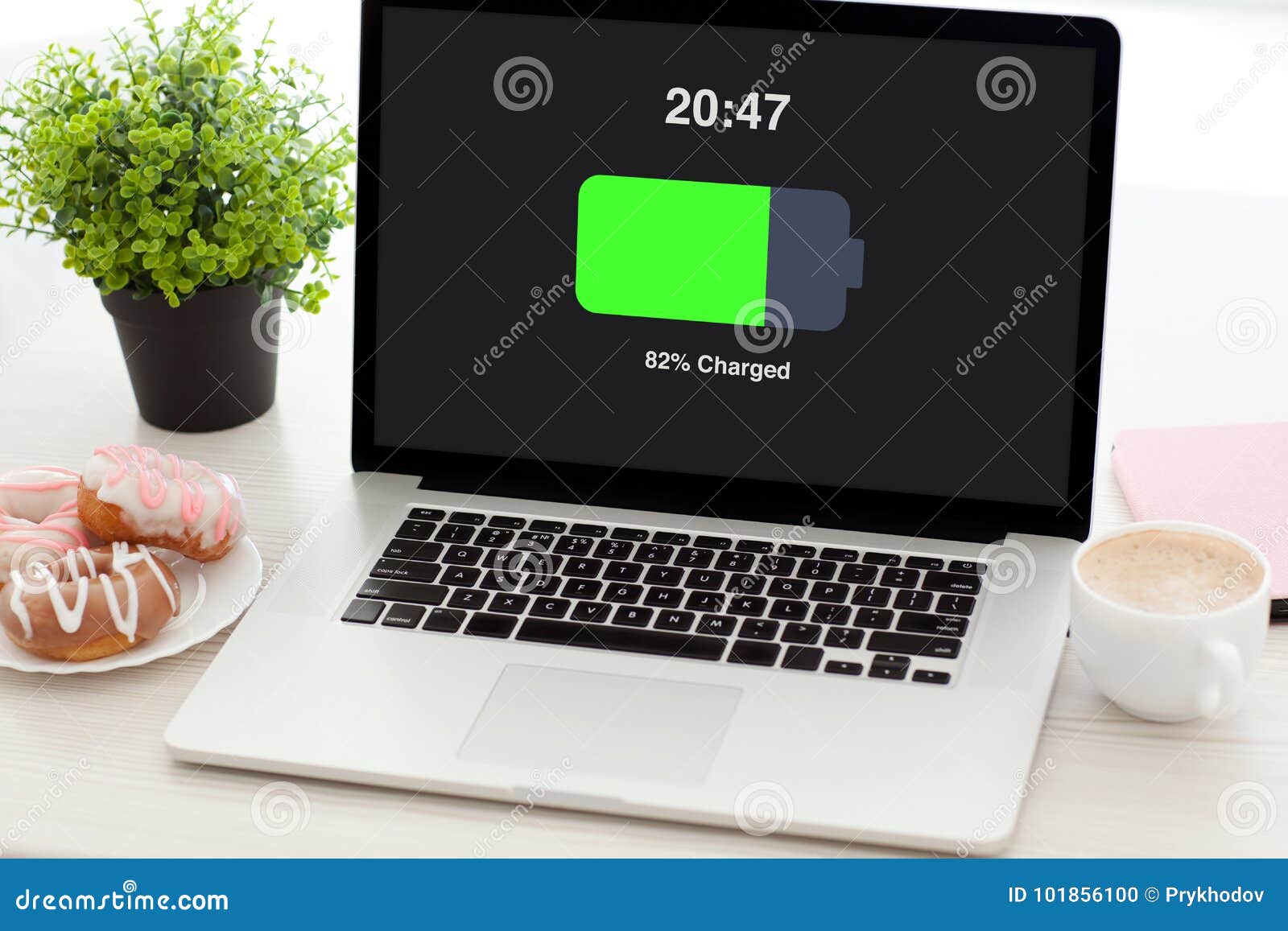 Notebook with Charged Battery Screen on Desk in Office Stock Photo ...