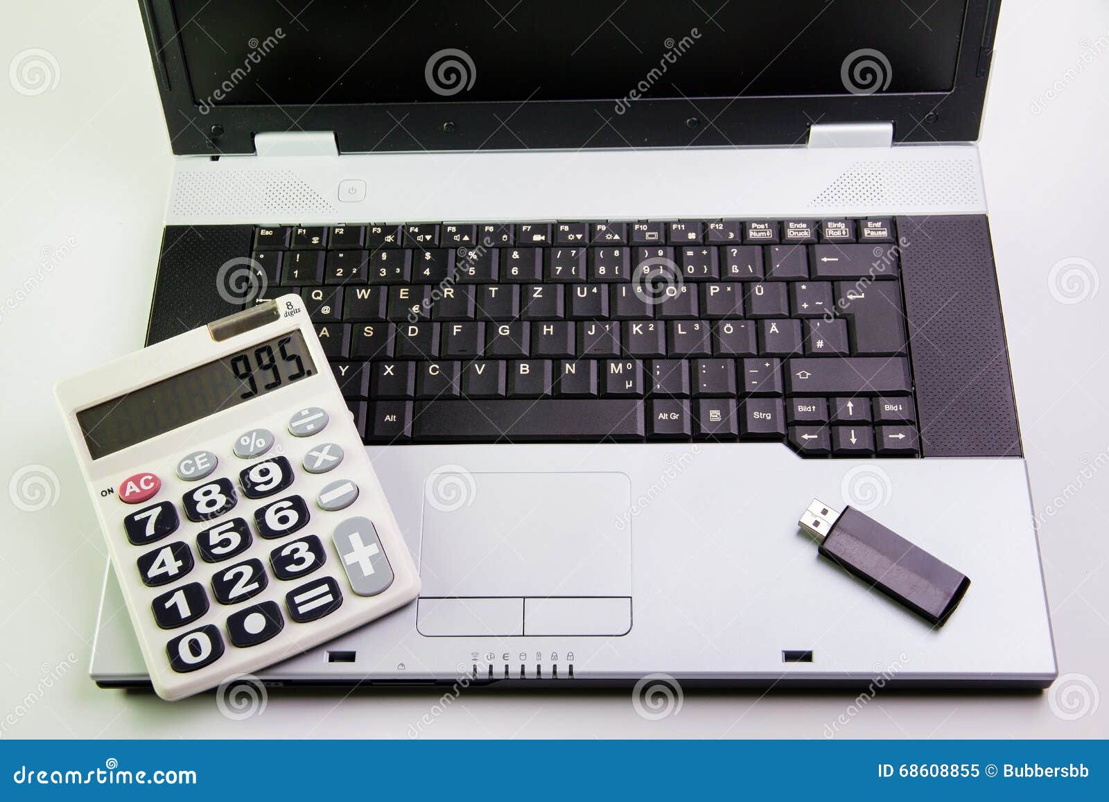 Notebook Computer on the Desk.Calculators,USB Flash Drive Stick Stock ...