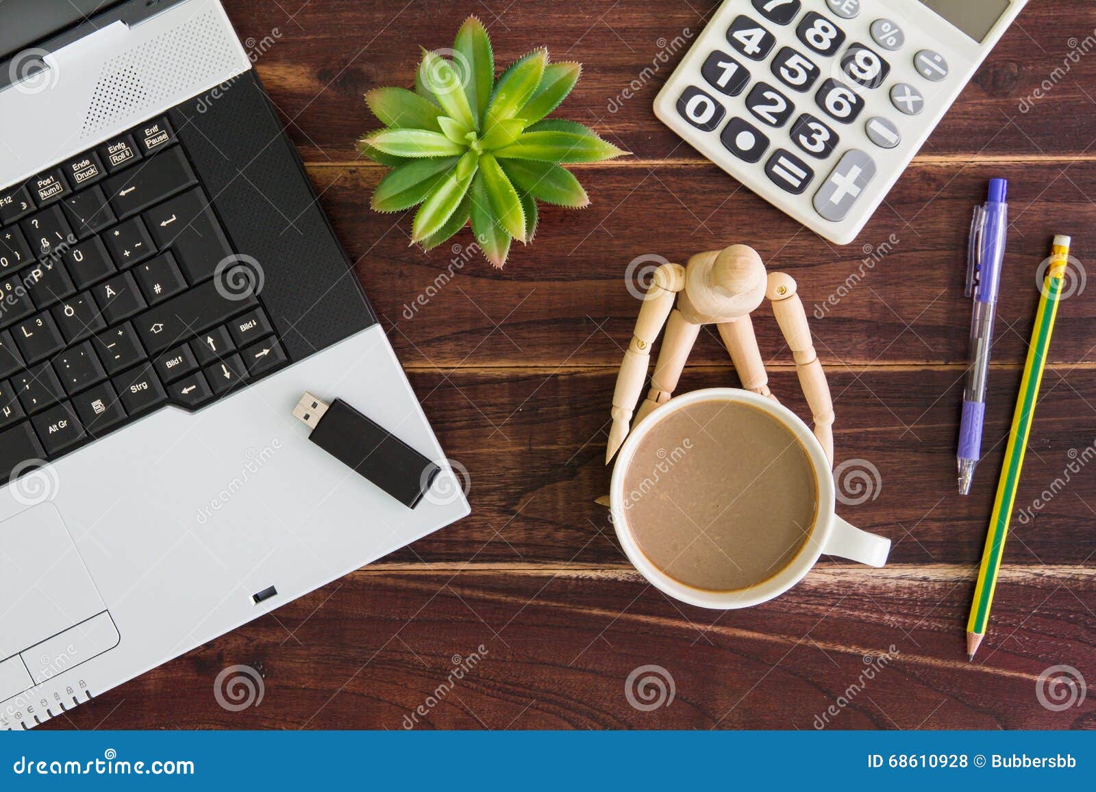 Notebook Computer on the Desk.Calculators,USB Flash Drive Stick,coffee ...