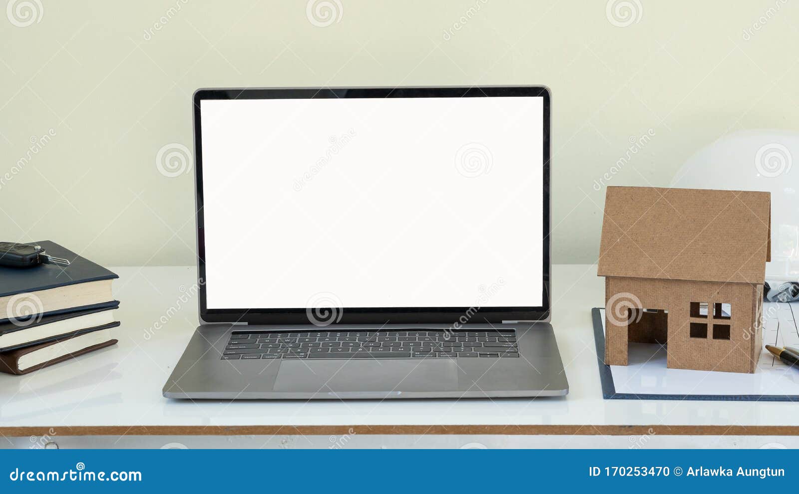 Notebook Computers with a White Screen on a Home-style Desk and a Tiger ...