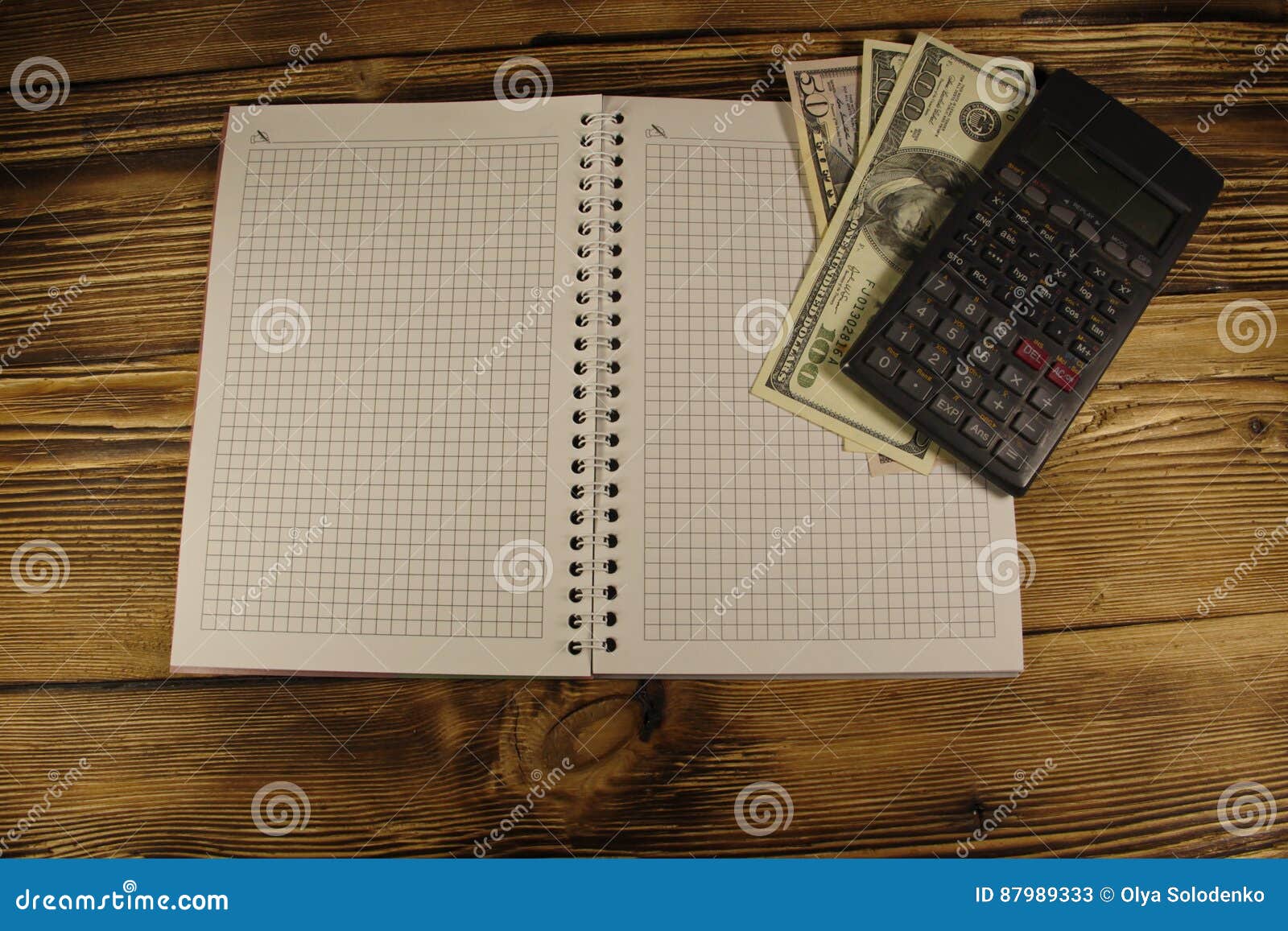 Notebook with Dollars and Calculator on Wooden Desk Stock Image - Image ...