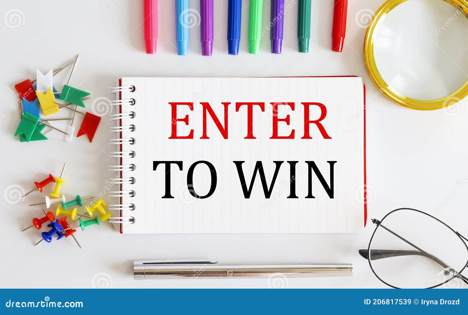 Notebook with ENTER TO WIN Word with Office Tools on the White Table ...