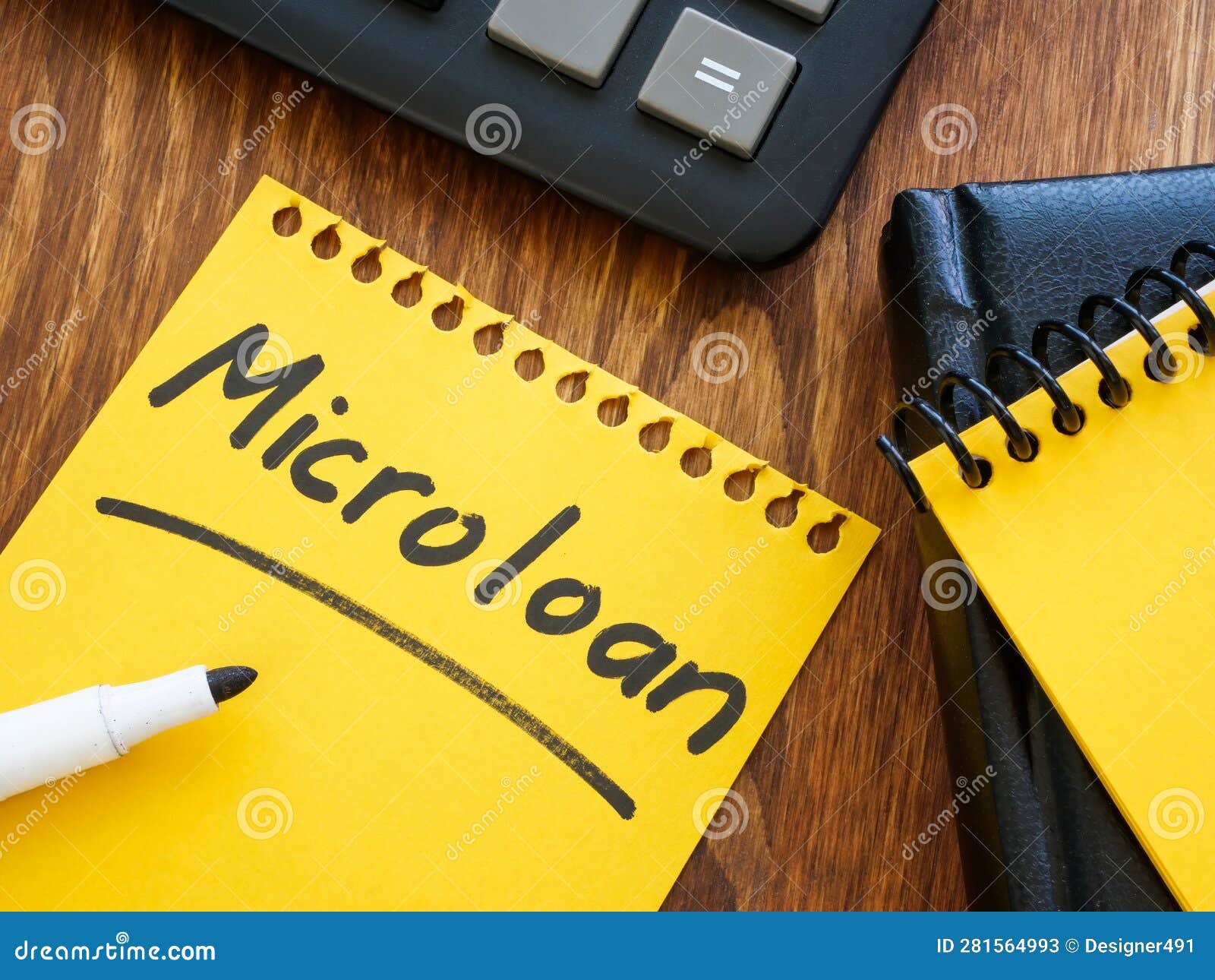 Notebook with Entry about Microloan and Calculator. Stock Image - Image ...