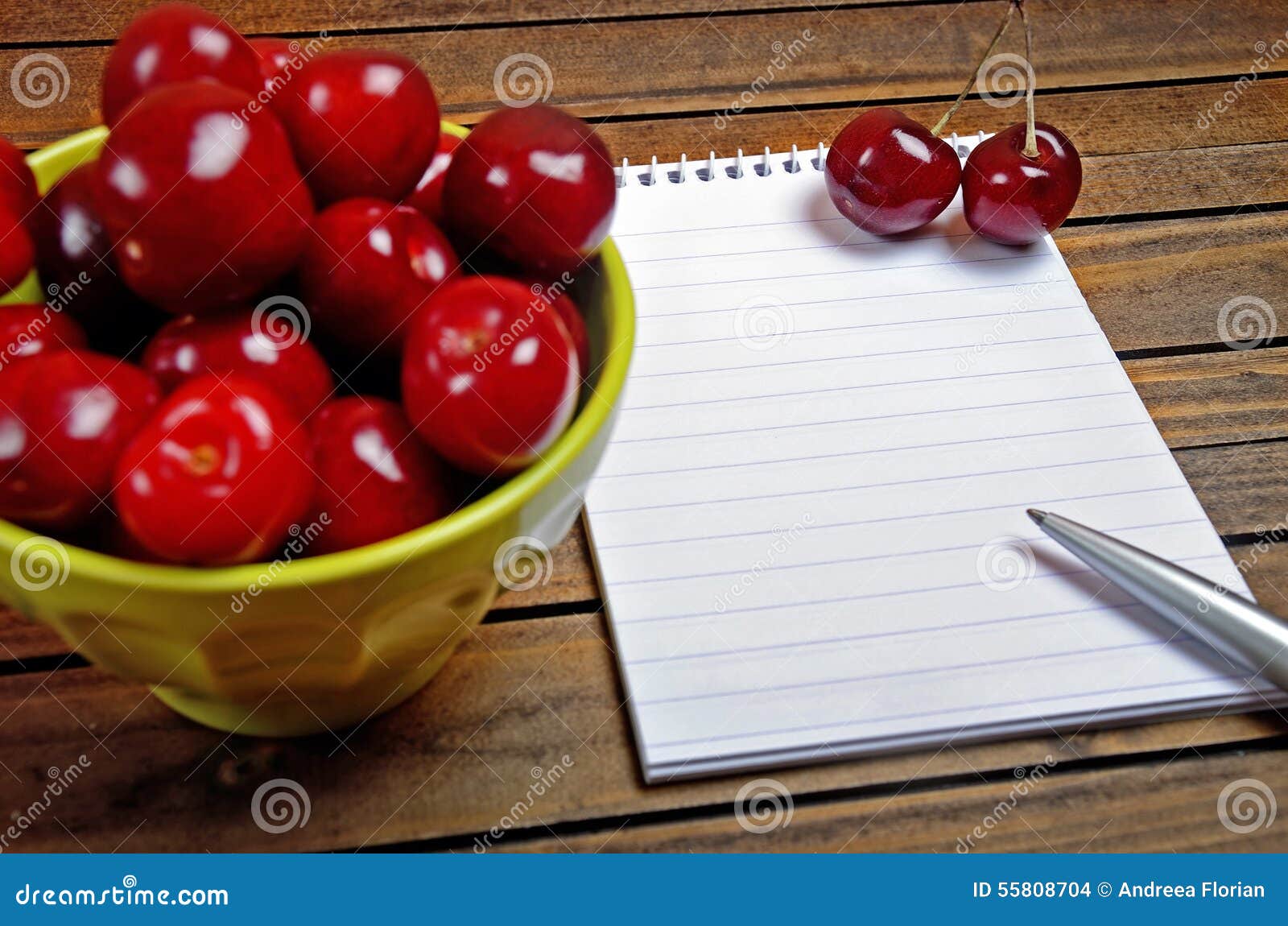 Notebook and Green Bowl with Cherries Stock Photo - Image of notebook ...