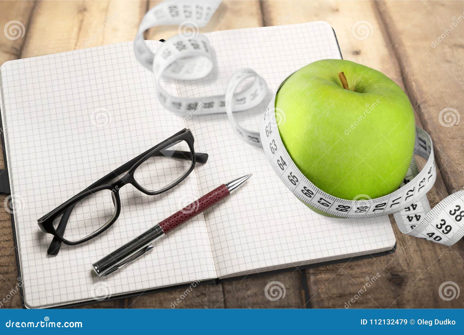 Notebook with Measuring Tape and an Apple on Stock Image - Image of ...
