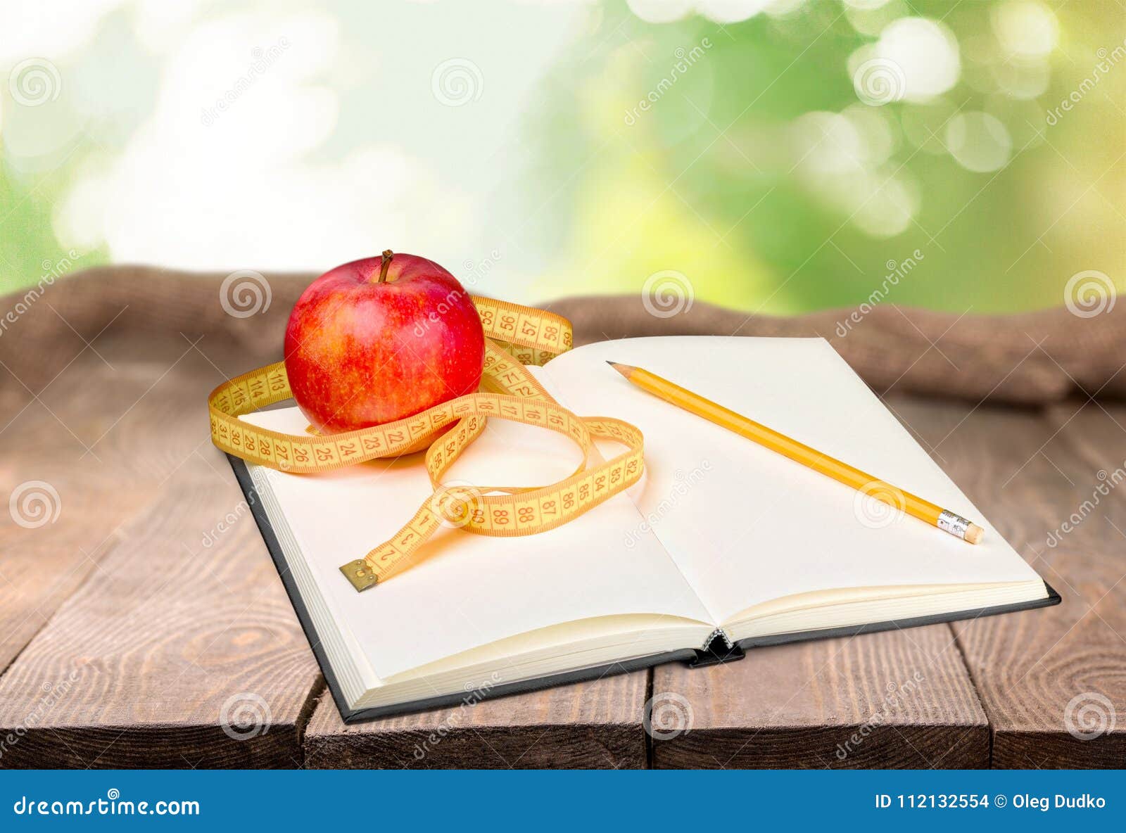 Notebook with Measuring Tape and an Apple on Stock Photo - Image of ...