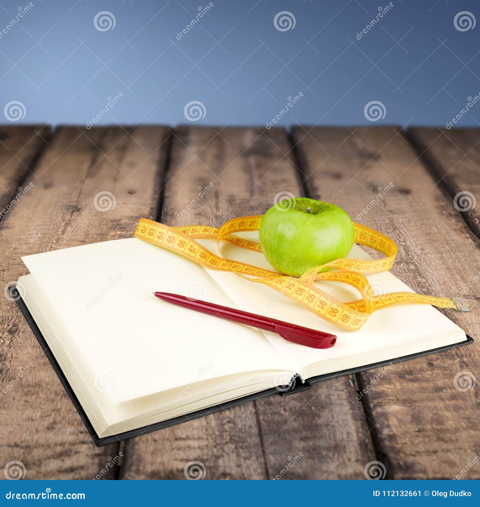 Notebook with Measuring Tape and an Apple on Stock Image - Image of ...