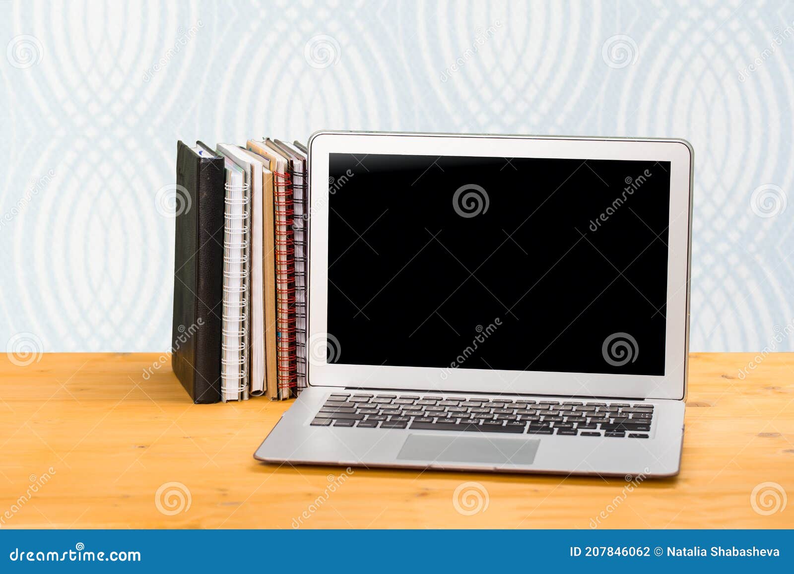 Notebook with Multi-colored Books on a Wooden Table. Mocap. Work from ...
