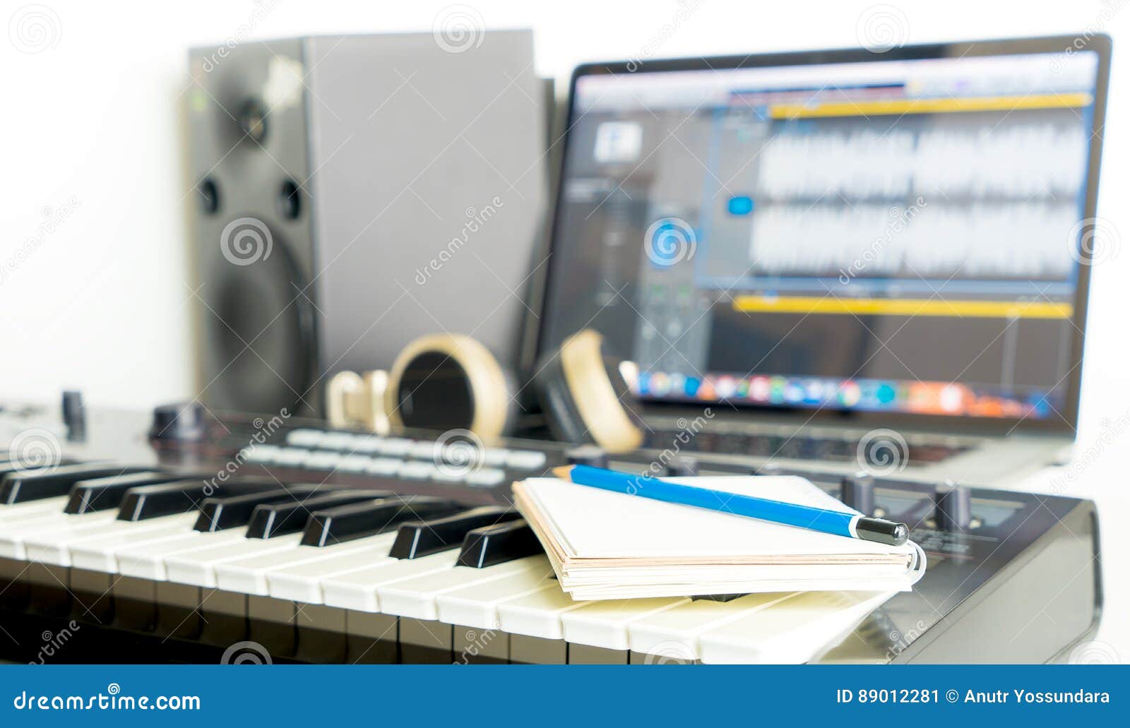 Notebook and Music Keyboard on Music Studio Desktop for Song Writer ...