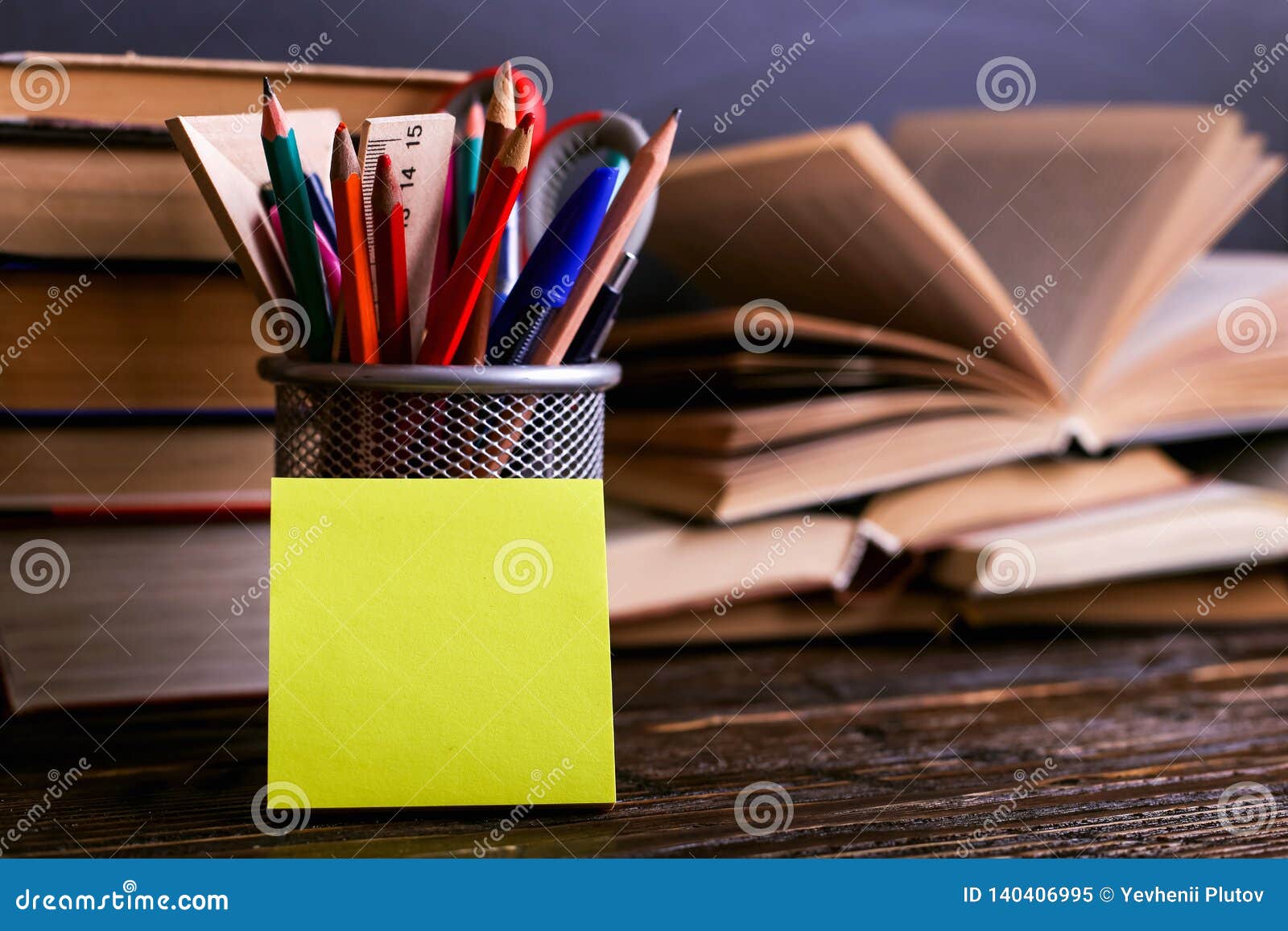 Notebook, Open Books and Stand for Pens on a Dark Wooden Table on the ...