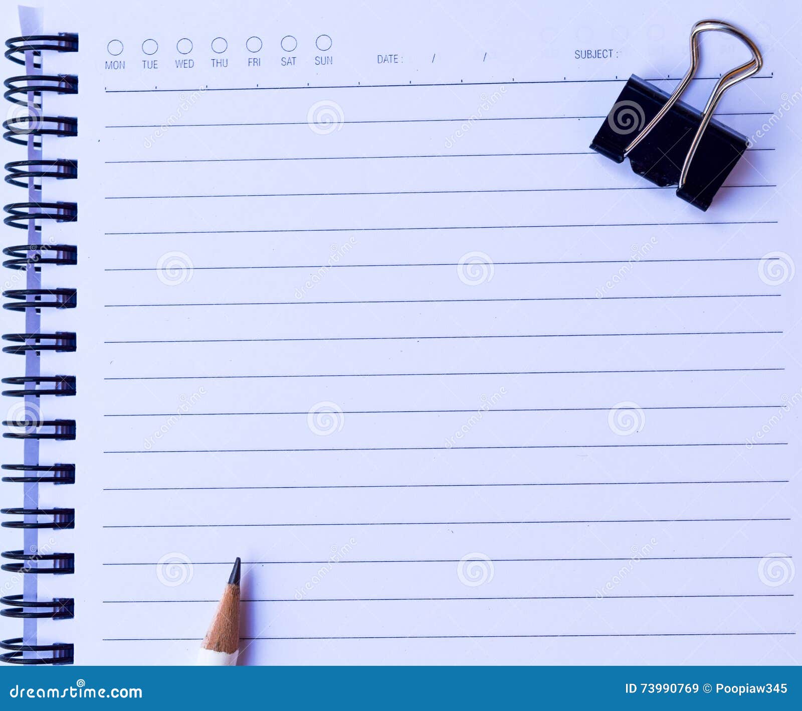 Notebook Paper With White Pencil And Black Paper Clip On White ...