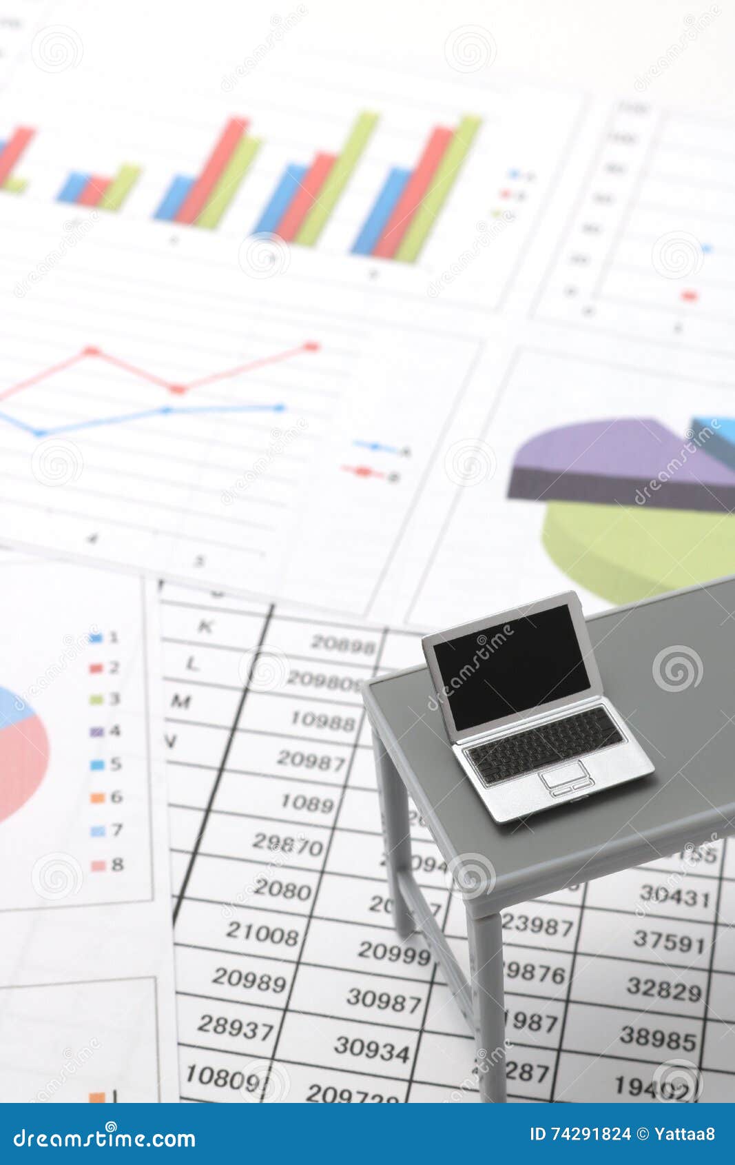 Notebook PC and Business Documents with Numbers and Charts. Stock Photo ...