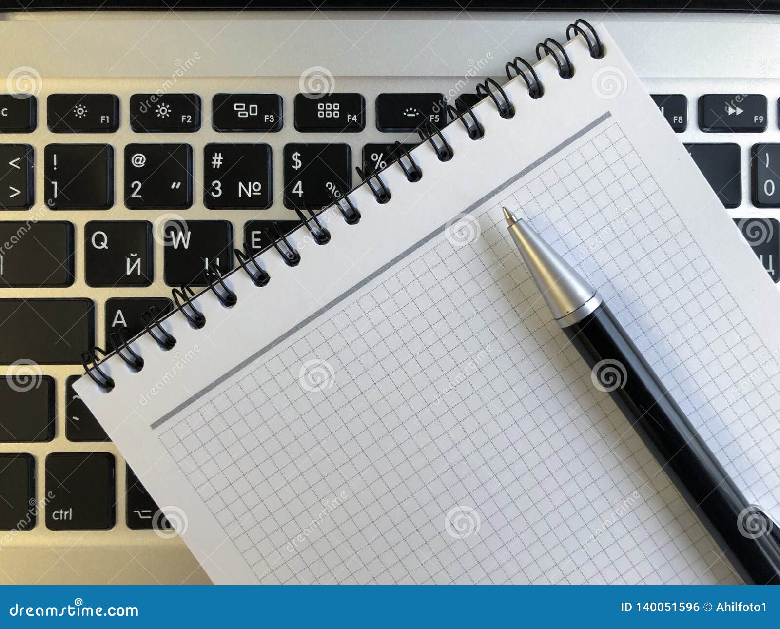 Notebook with Pen on Laptop Keyboard. Stock Photo - Image of keyboard ...