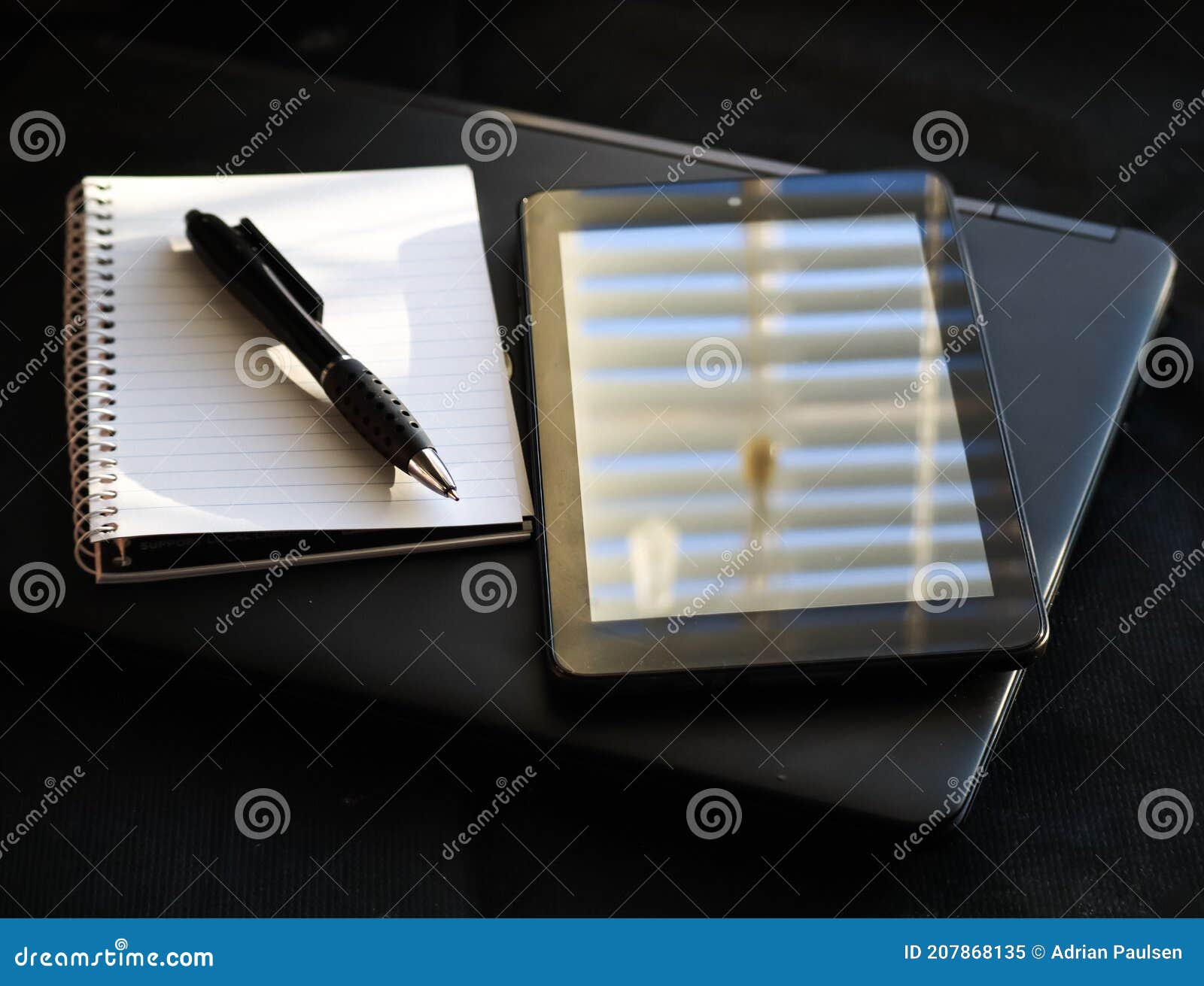 Notebook, Pen, Tablet and Laptop with Window Blind Reflection Stock ...