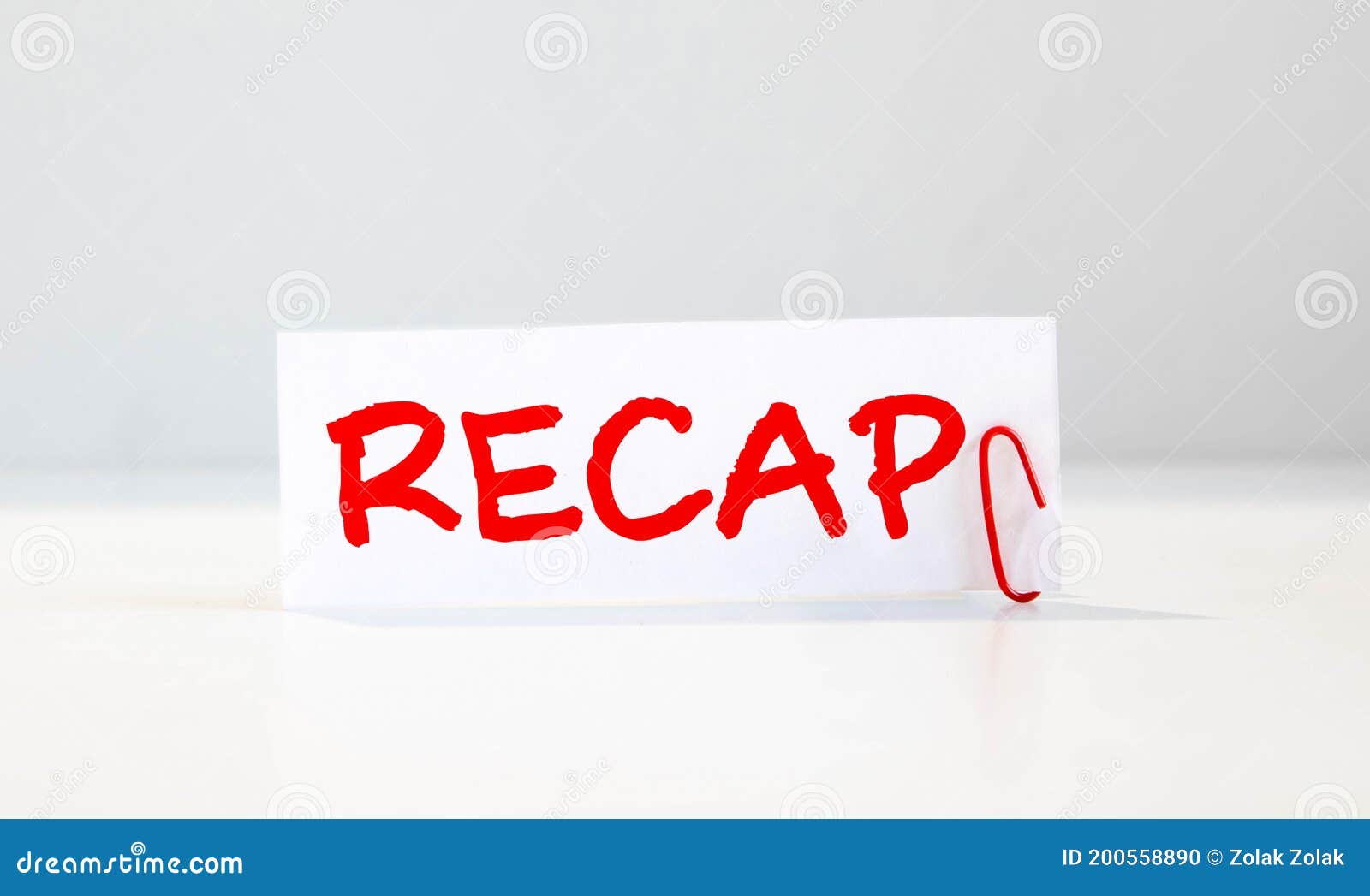 Notebook with a Pen and the Word Recap, on the Background of a Laptop ...