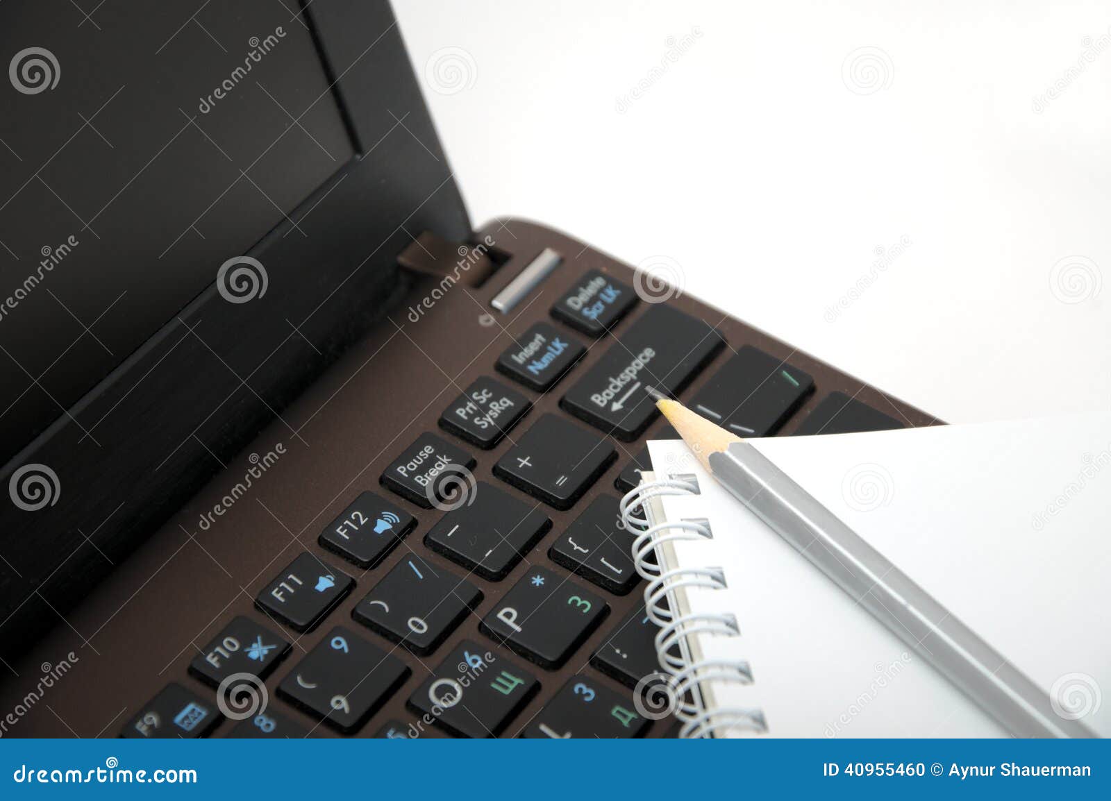 Notebook with Pencil on Laptop Keyboard Stock Photo - Image of computer ...