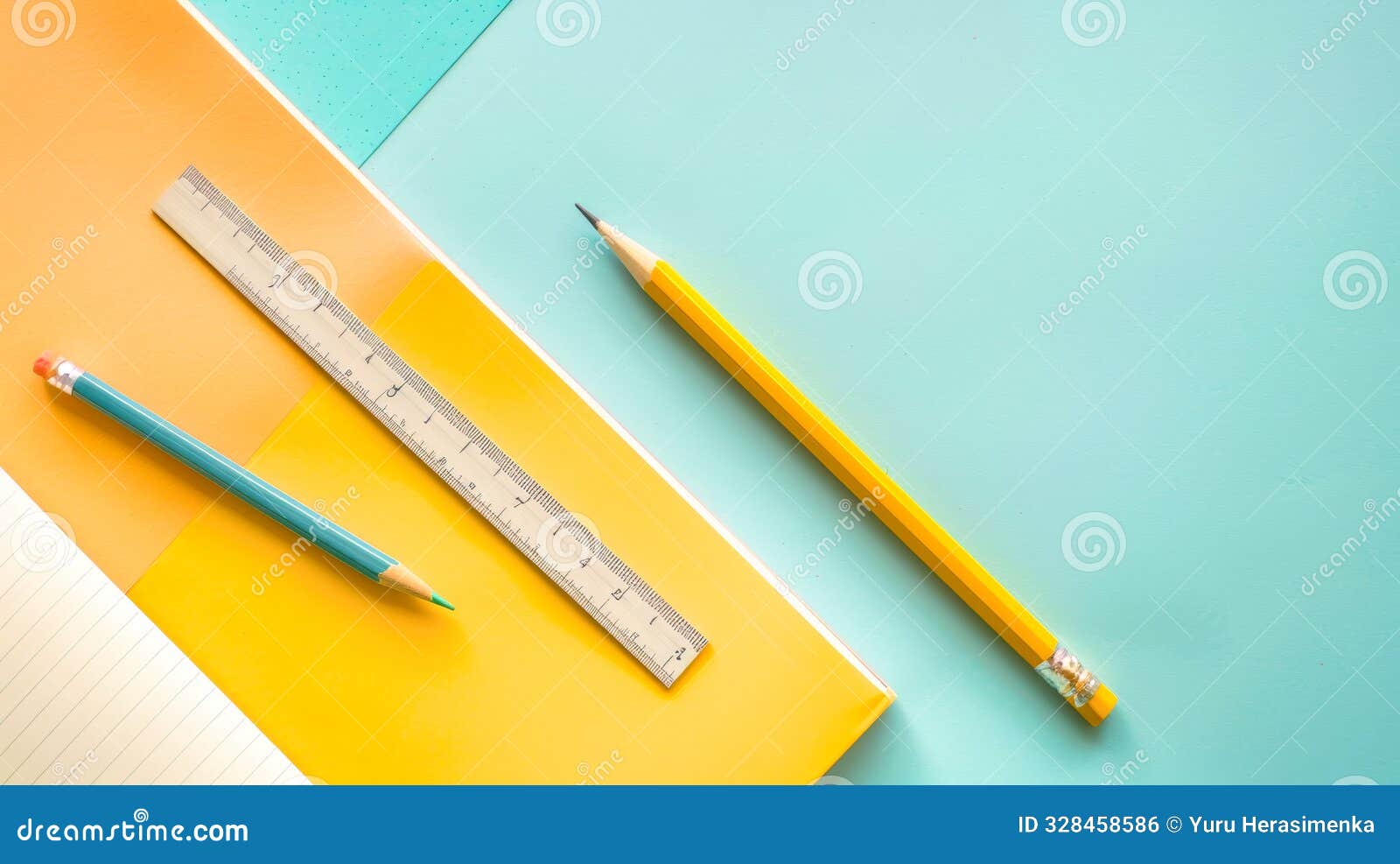 A Notebook, Pencil, and Ruler Lay on a Colorful, Pastel Background ...