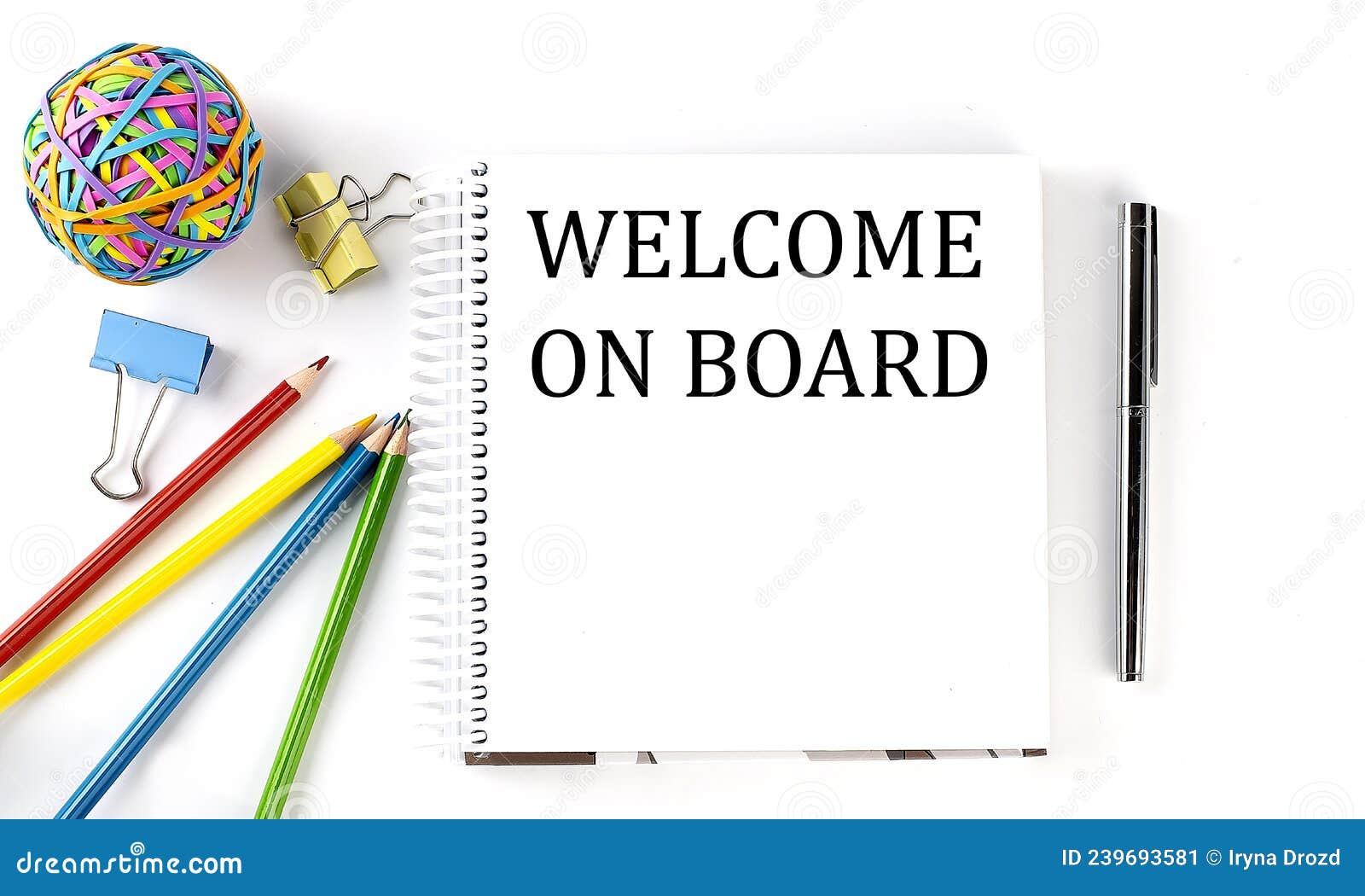 Notebook ,pencils,pen and Rubber Band with Text WELCOME on BOARD on the ...