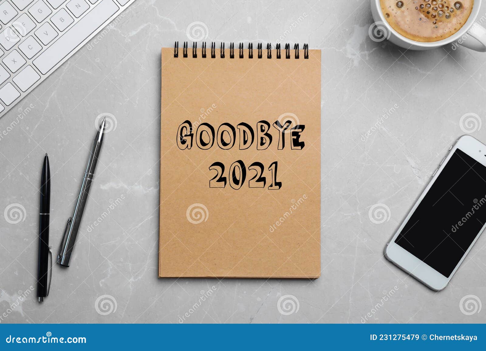 Notebook with Phrase Goodbye 2021, Smartphone, Keyboard, Pens and Cup ...