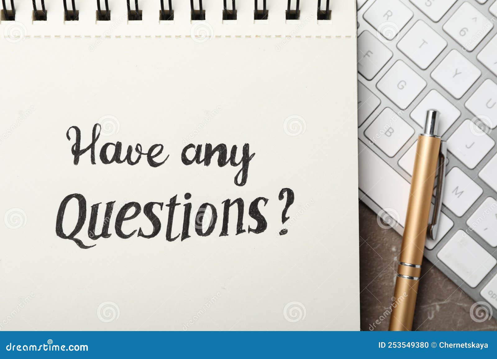 Notebook with Phrase HAVE ANY QUESTIONS and Keyboard on Grey Marble ...