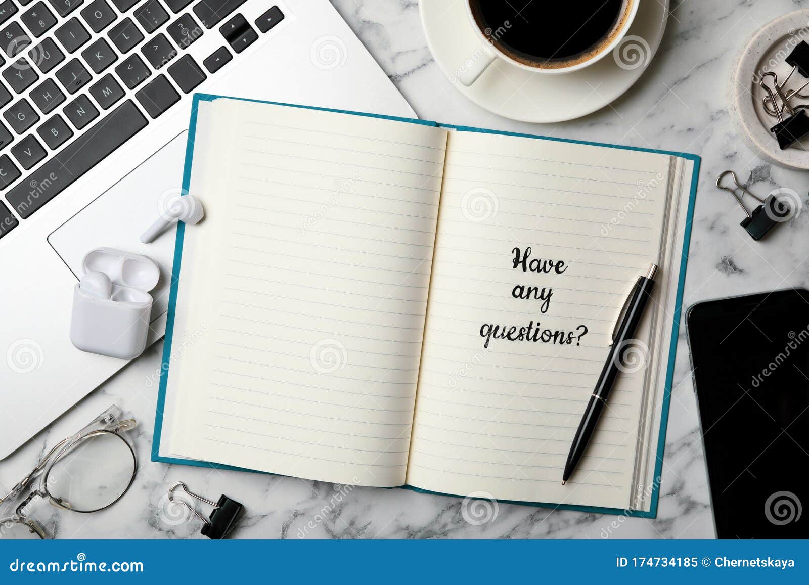 Notebook with Phrase HAVE ANY QUESTIONS and Laptop on Table Stock Image ...