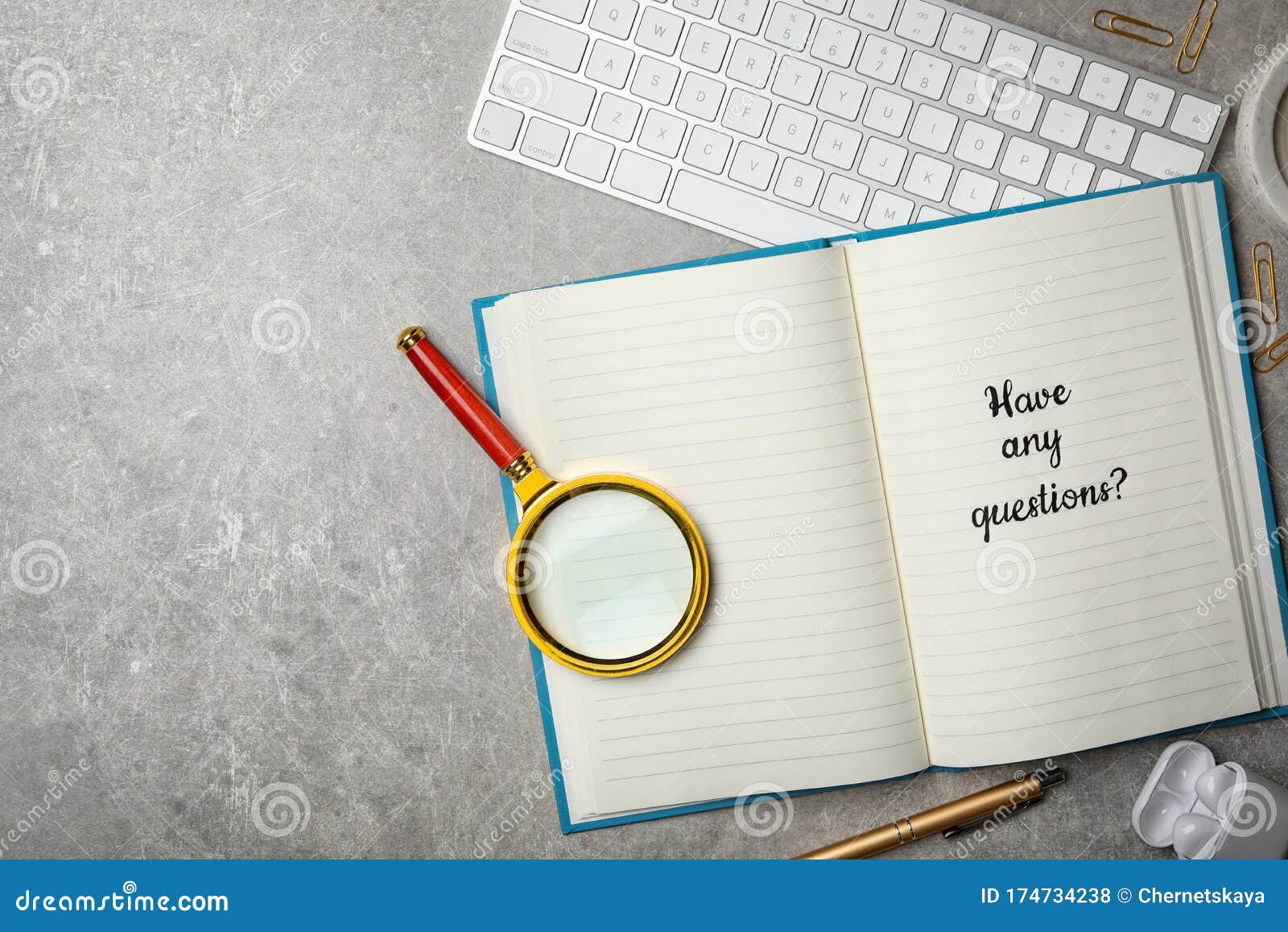 Notebook with Phrase HAVE ANY QUESTIONS and Magnifying Glass on Grey ...