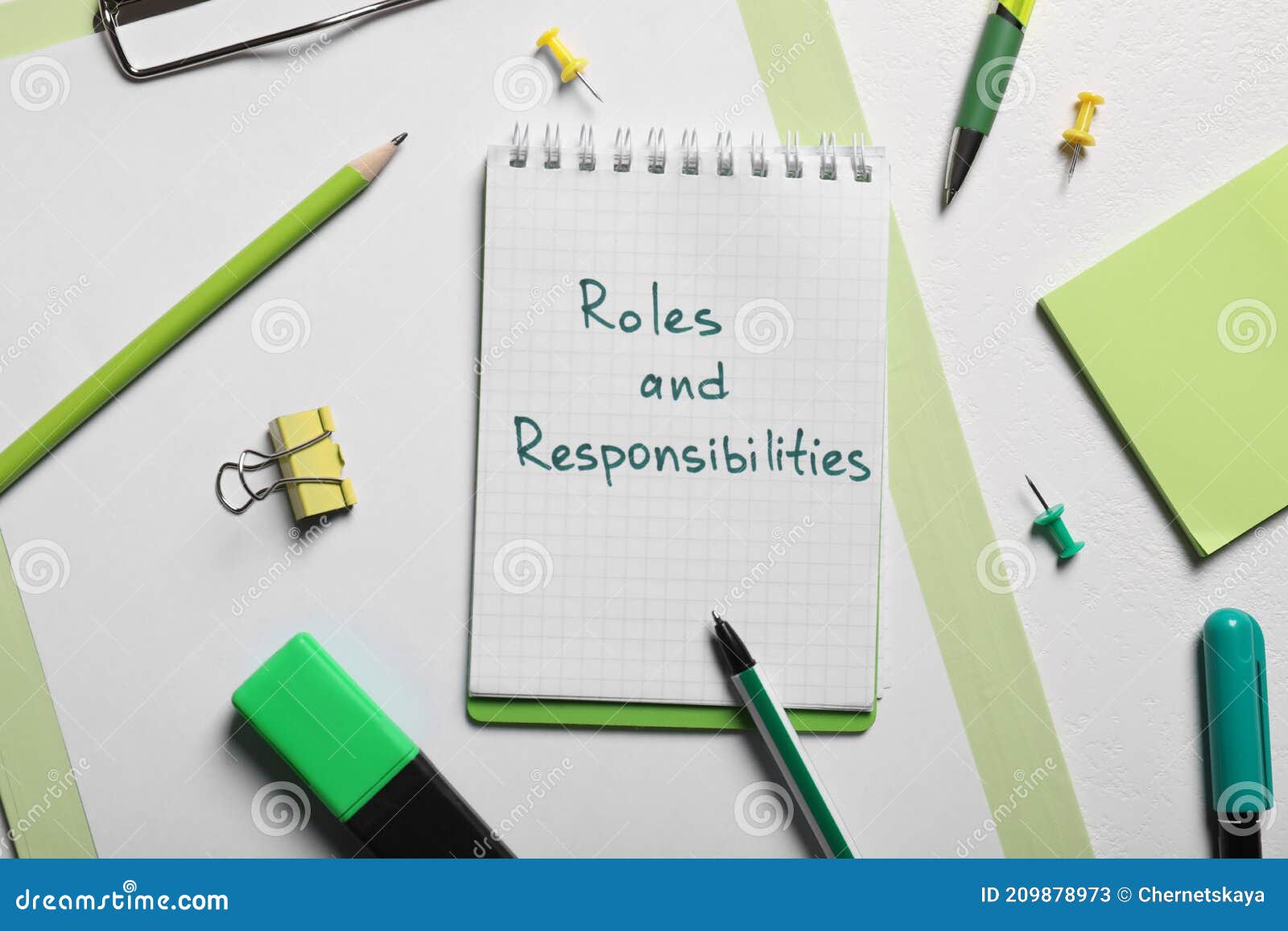 Notebook with Phrase Roles and Responsibilities among Office Supplies ...