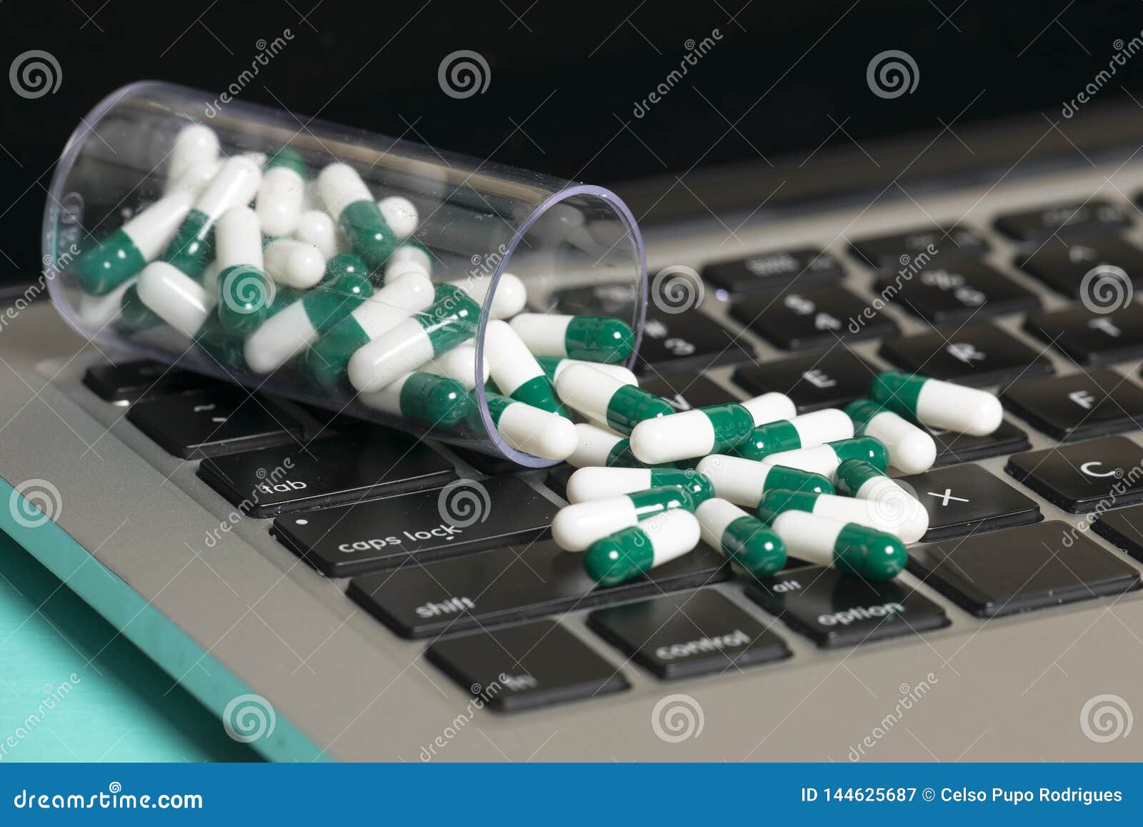 Notebook and pills stock image. Image of laptop, design - 144625687