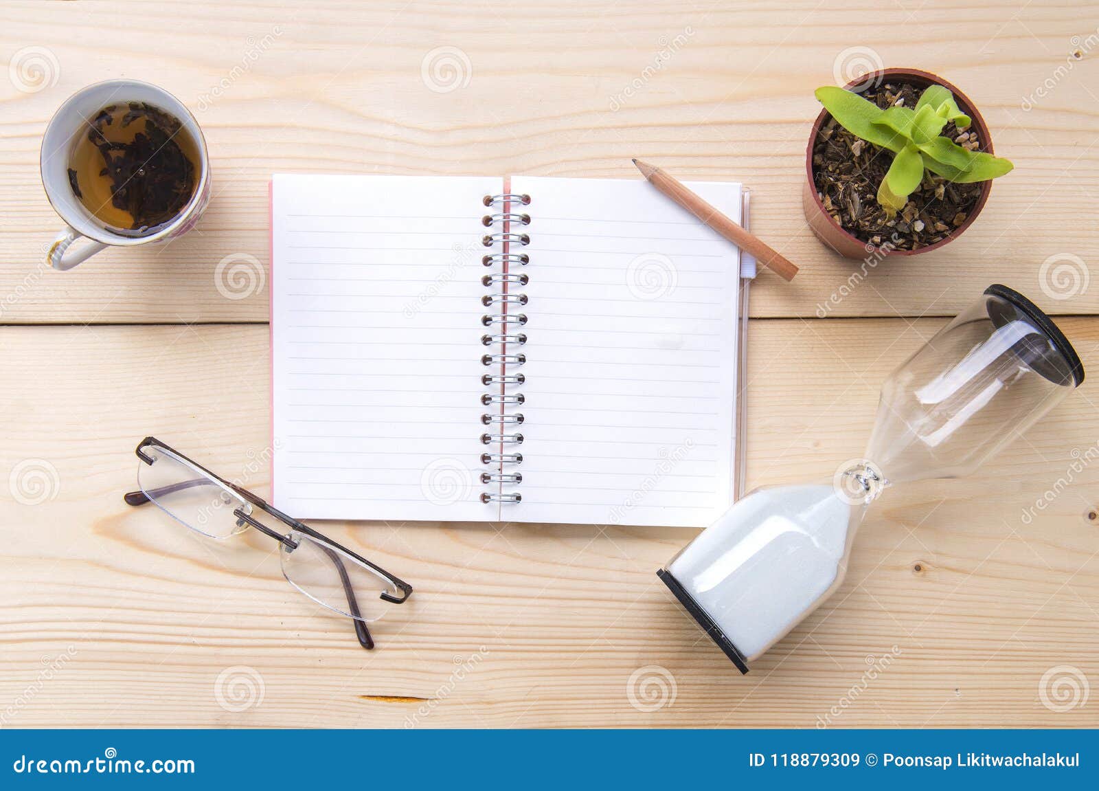 A Notebook Placed on a Wooden Table Stock Image - Image of notepad ...