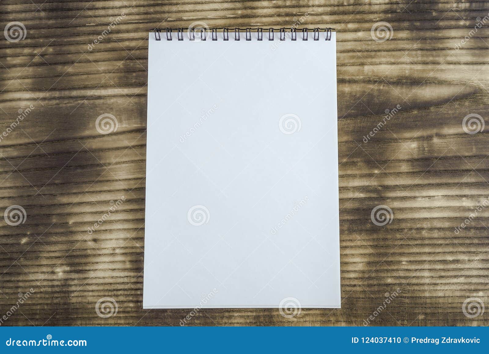 A Notebook Placed on a Wooden Table Stock Photo - Image of grain, panel ...