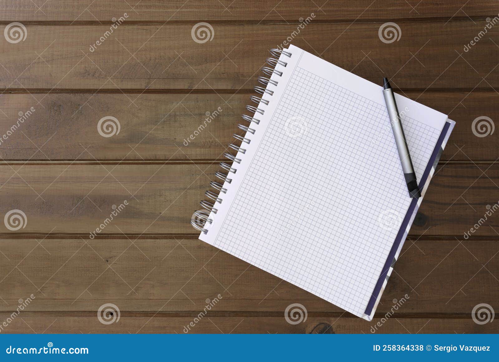 Notebook with Square Pages and Pen on a Wooden Table Stock Photo ...