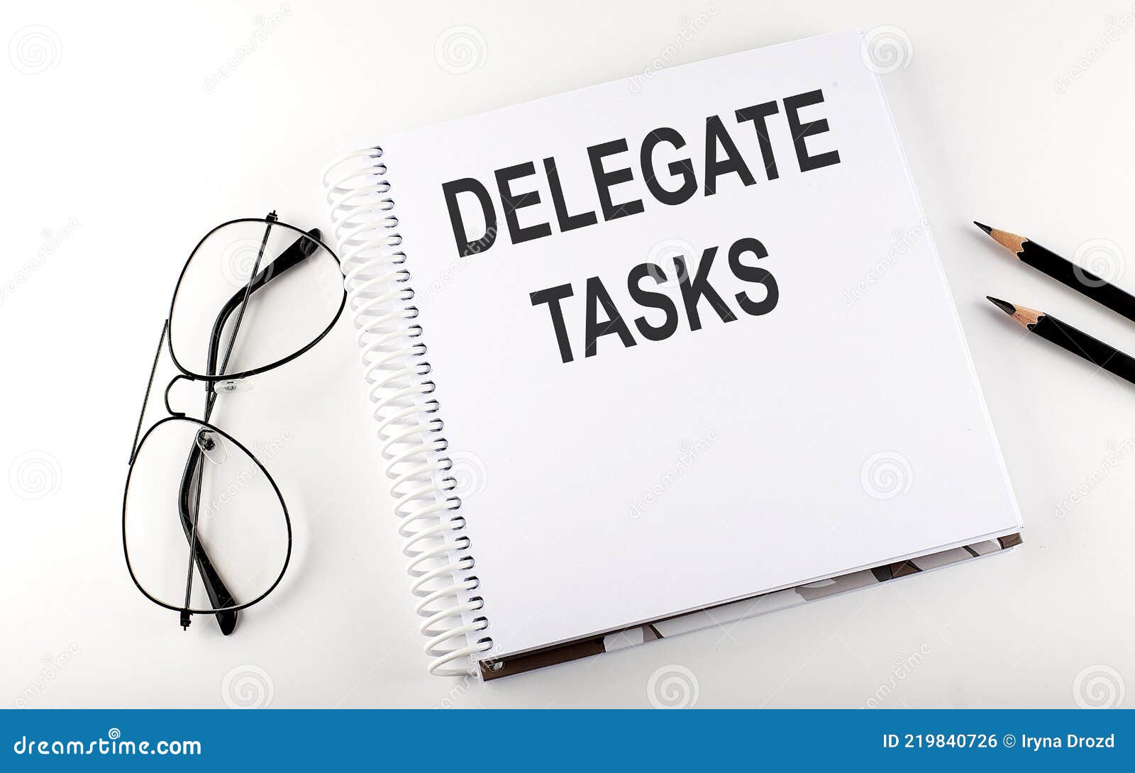 Notebook with Text DELEGATE TASKS on the White Background Stock Photo ...