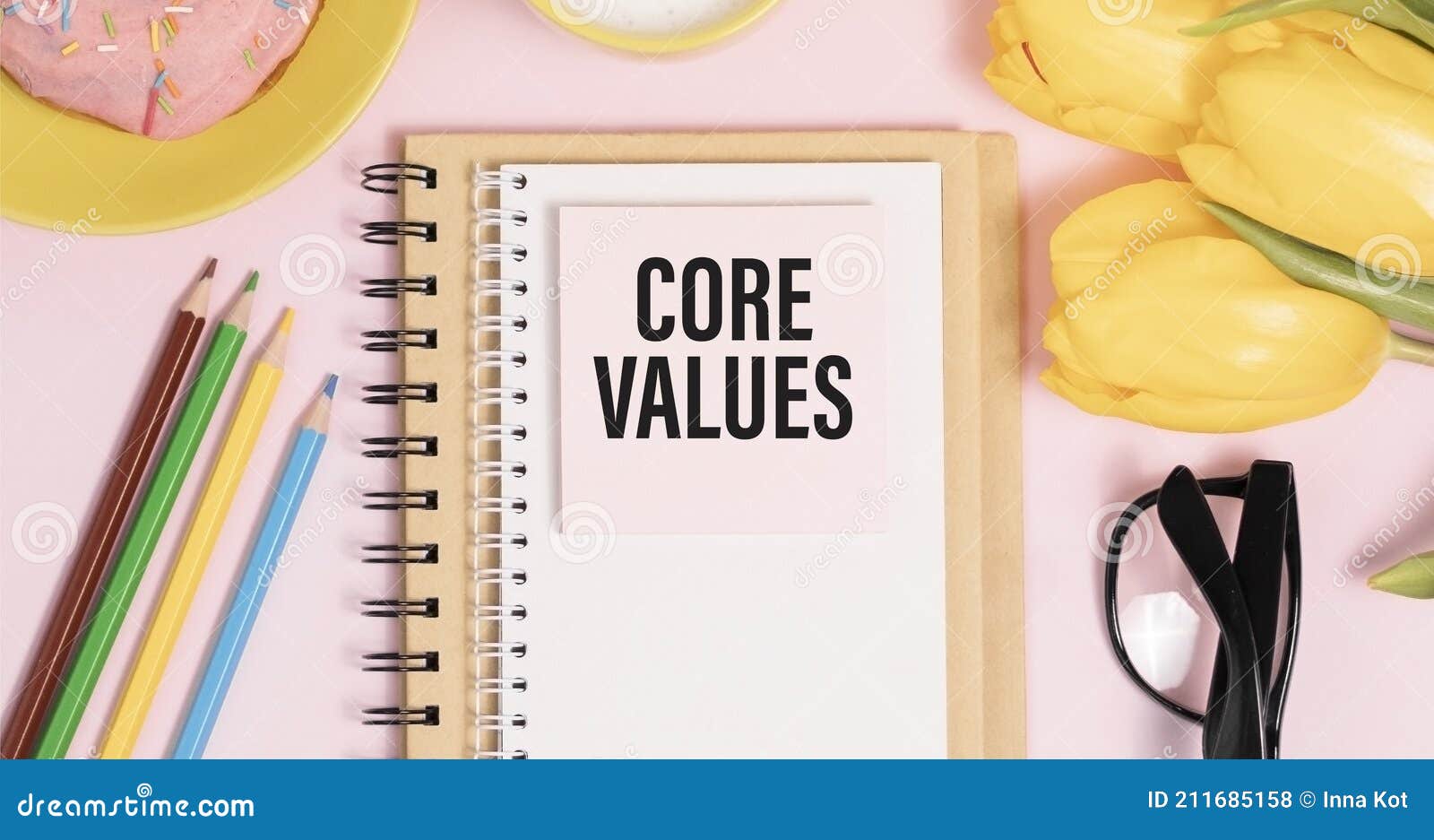 Text Inside Core Values on Table with Flowers, Laptop and Some Sheet of ...