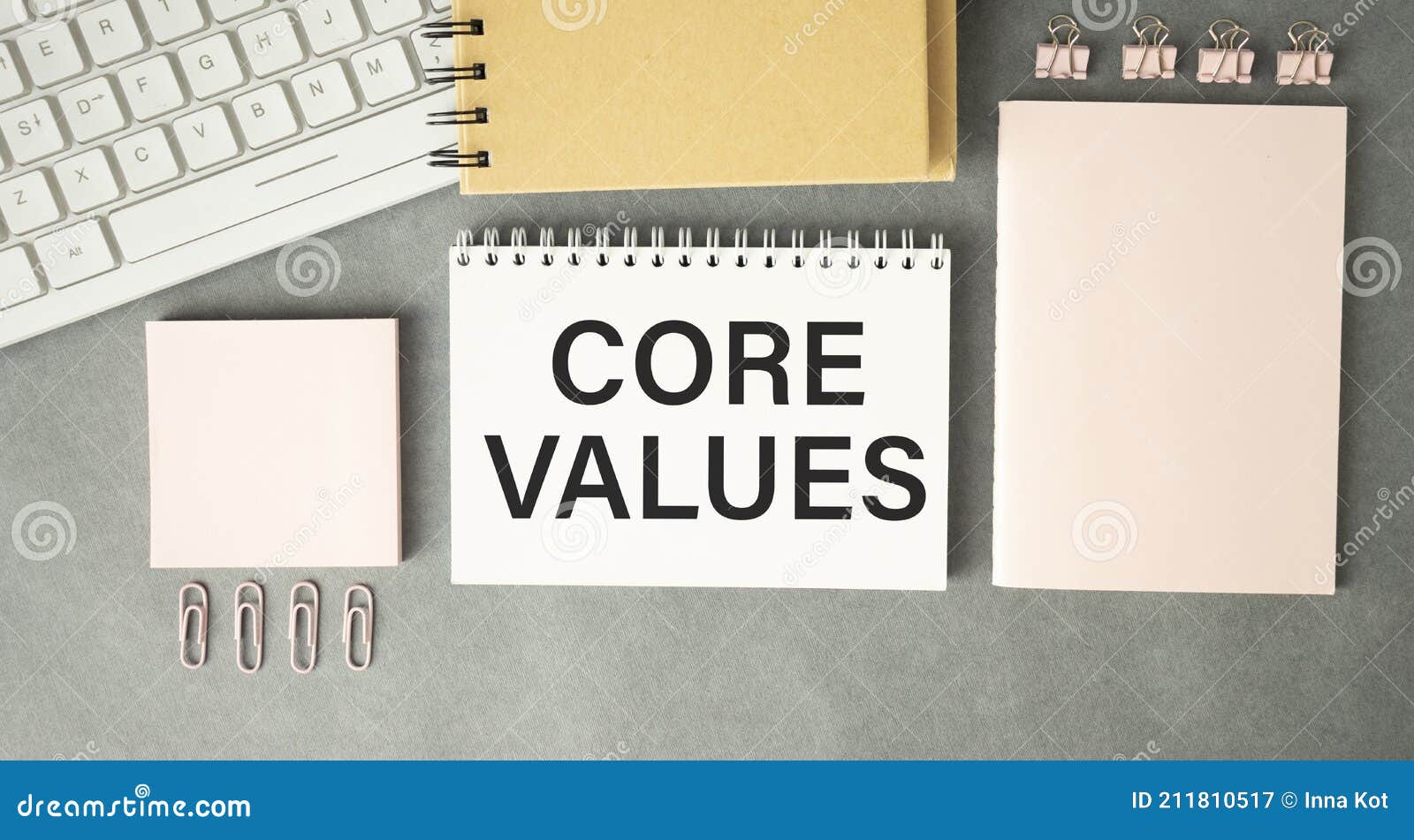 Inside Core Values on Table with Laptop and Some Sheet of Papers with ...